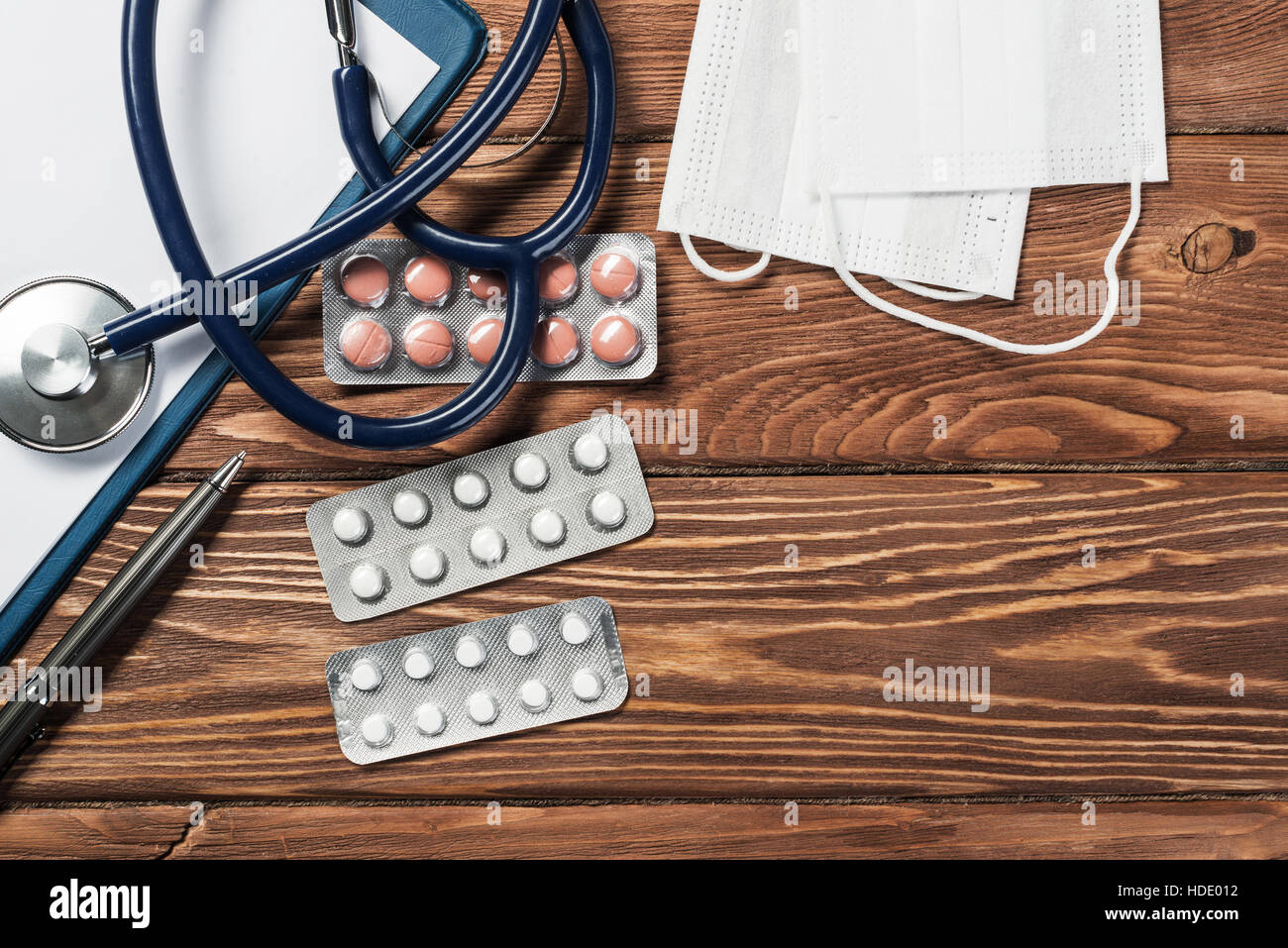 Desk of doctor with medicine things Stock Photo - Alamy