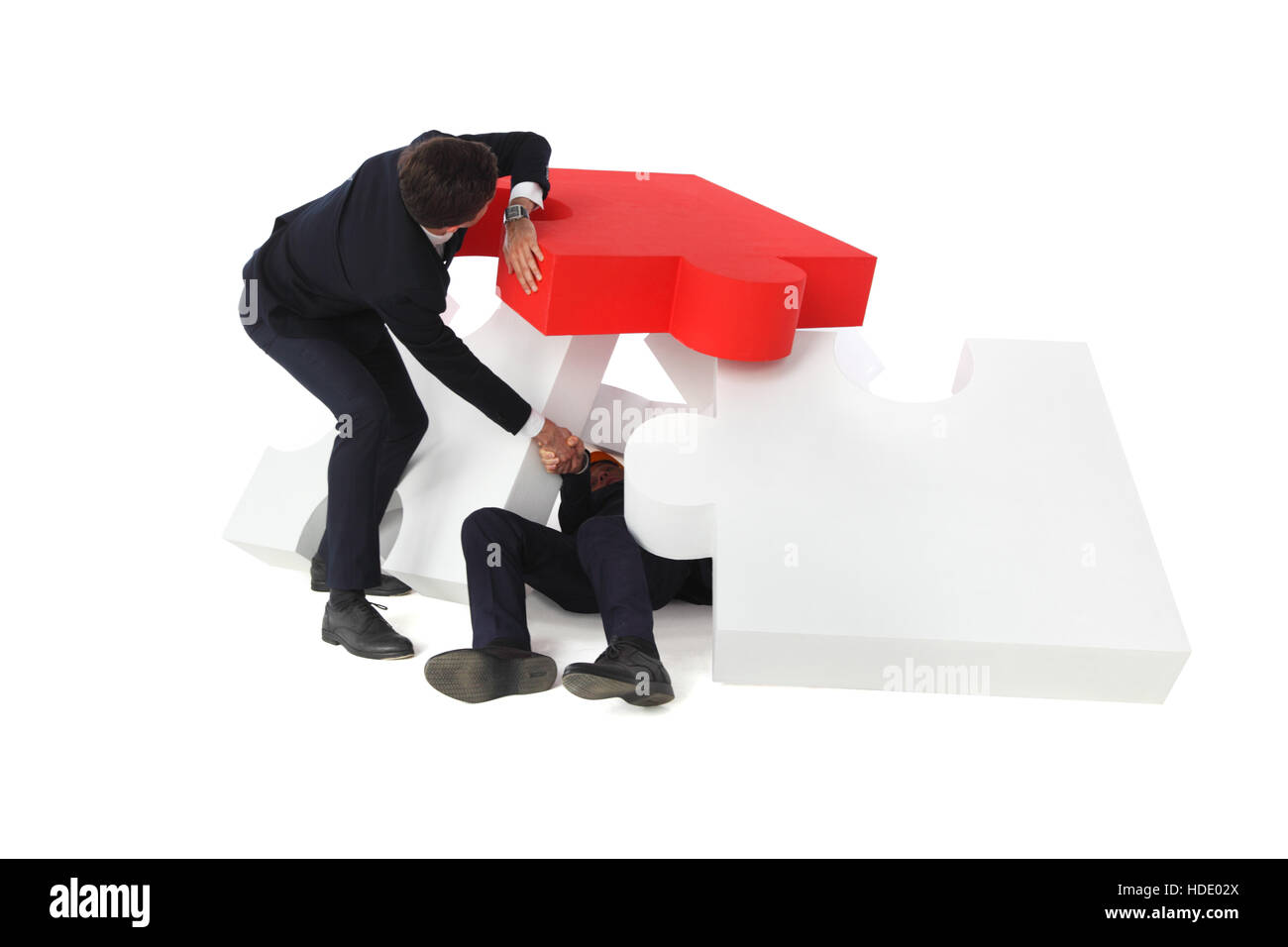 One businessman saving another from heap of problems concept, isolated ...