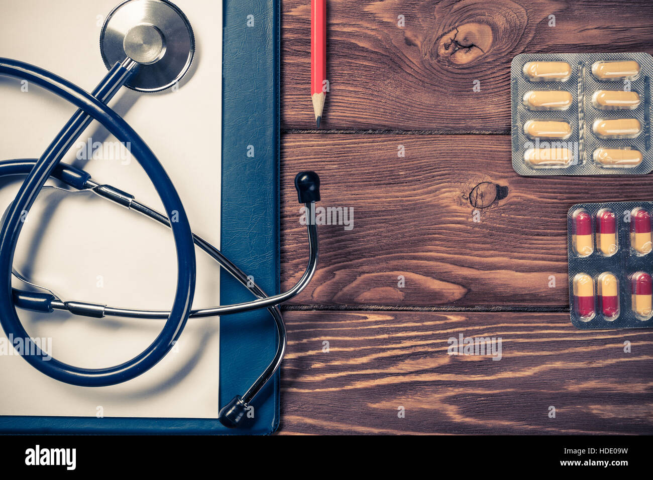 Desk of doctor with medicine things Stock Photo - Alamy