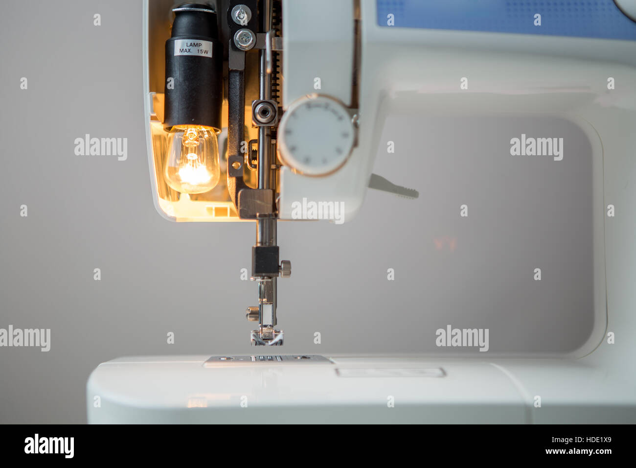 Dismantled sewing machine on empty gray background Stock Photo - Alamy