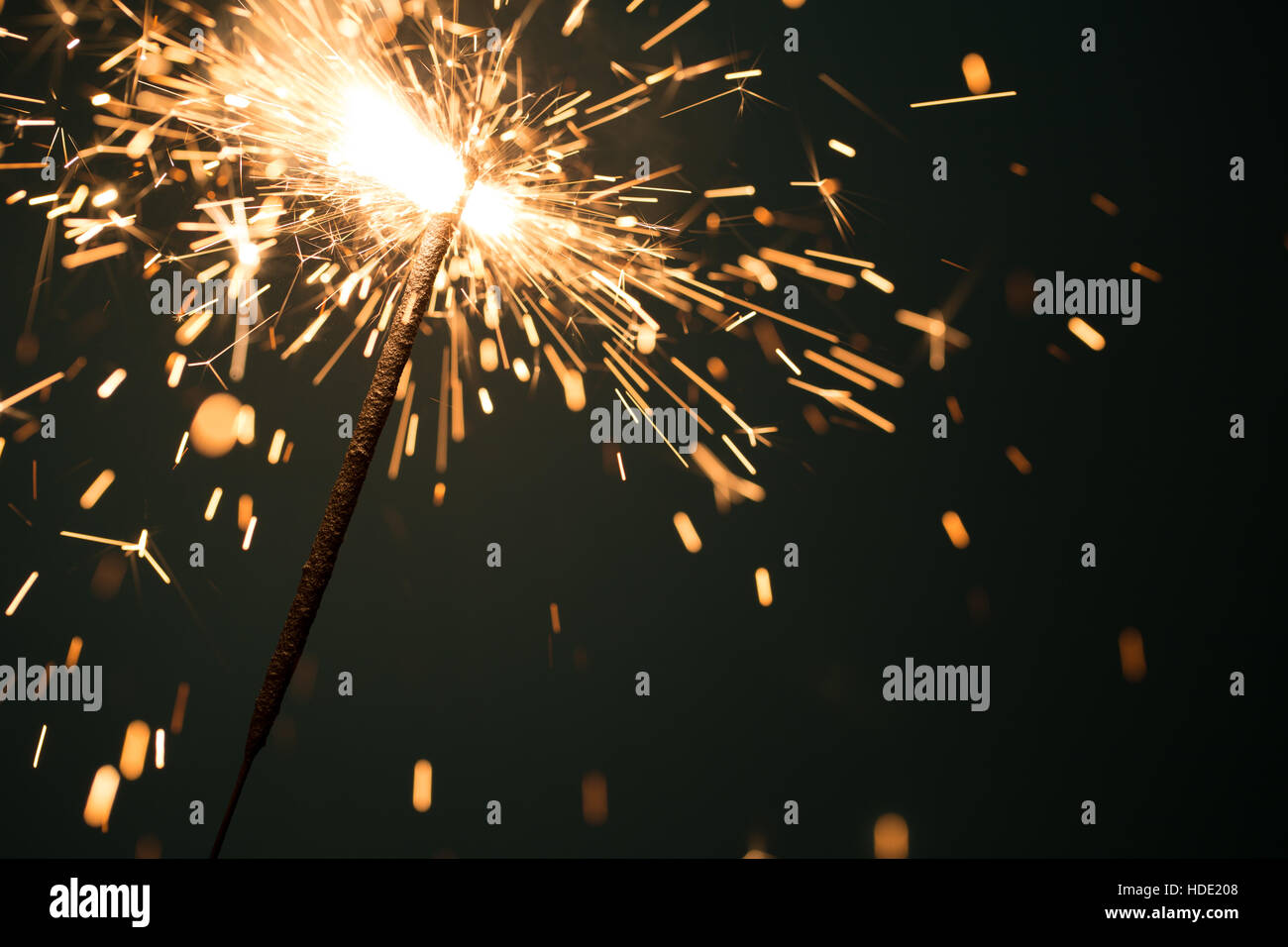 Burning Bengal fire on black background empty Stock Photo - Alamy