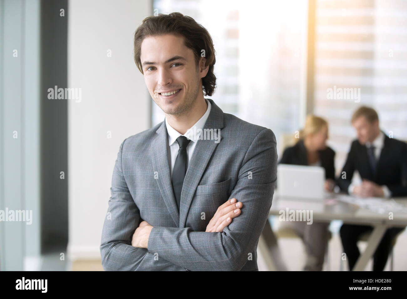 Portrait of a young smiling businessman Stock Photo - Alamy