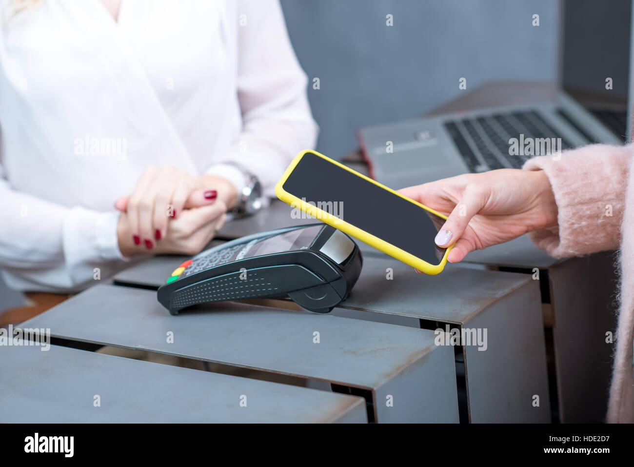 Paying with mobile phone Stock Photo - Alamy