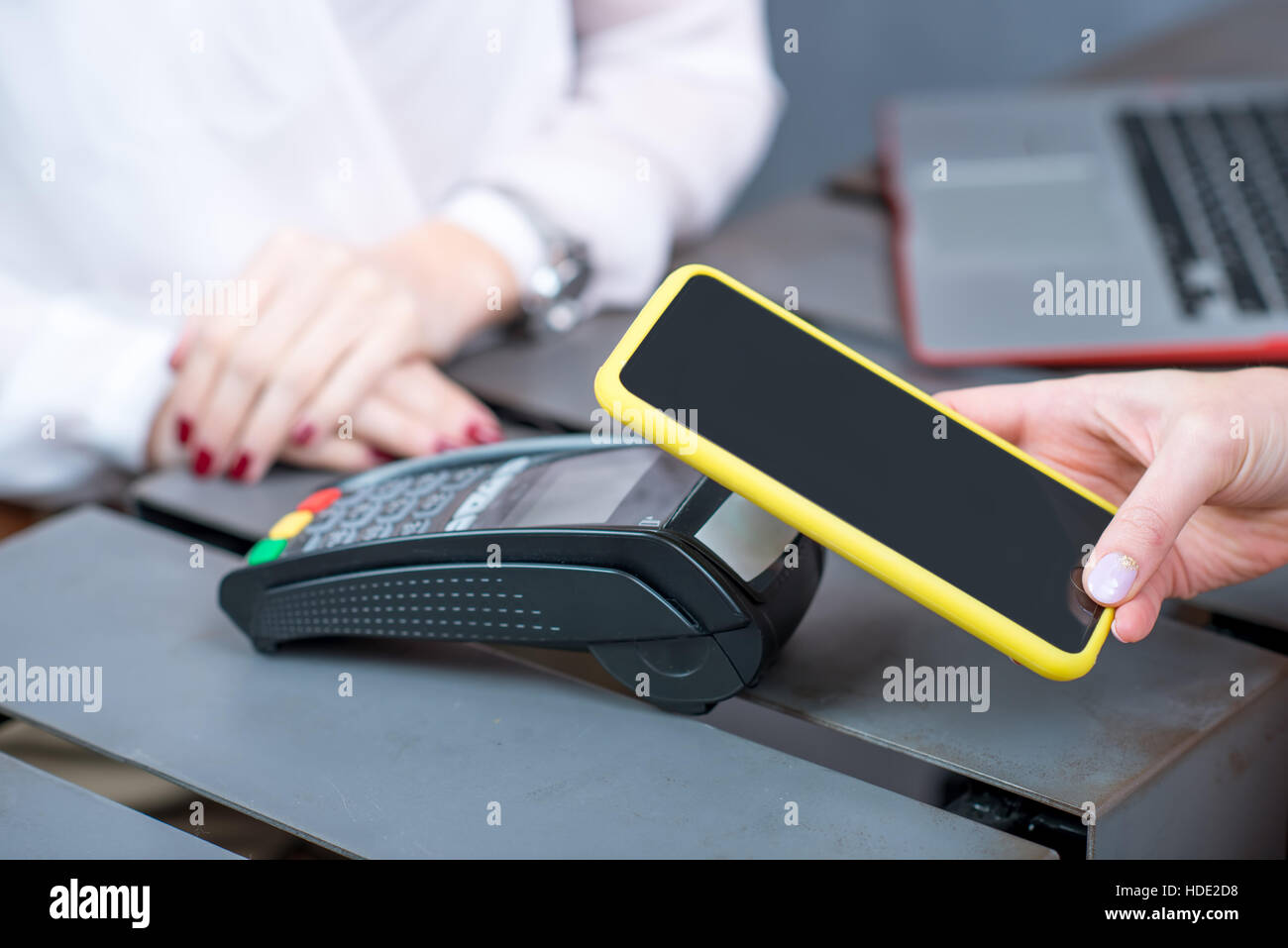 Paying with mobile phone Stock Photo - Alamy
