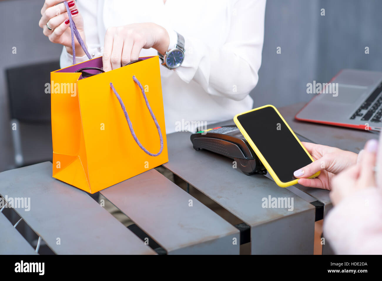 Paying with mobile phone Stock Photo - Alamy