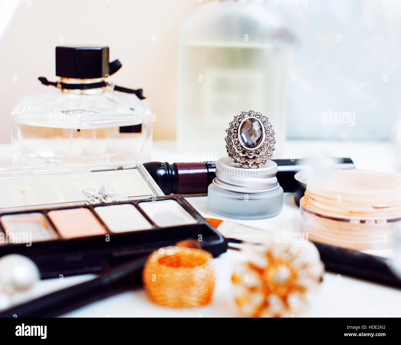 Jewelry table with lot of girl stuff on it, little mess in cosme Stock ...