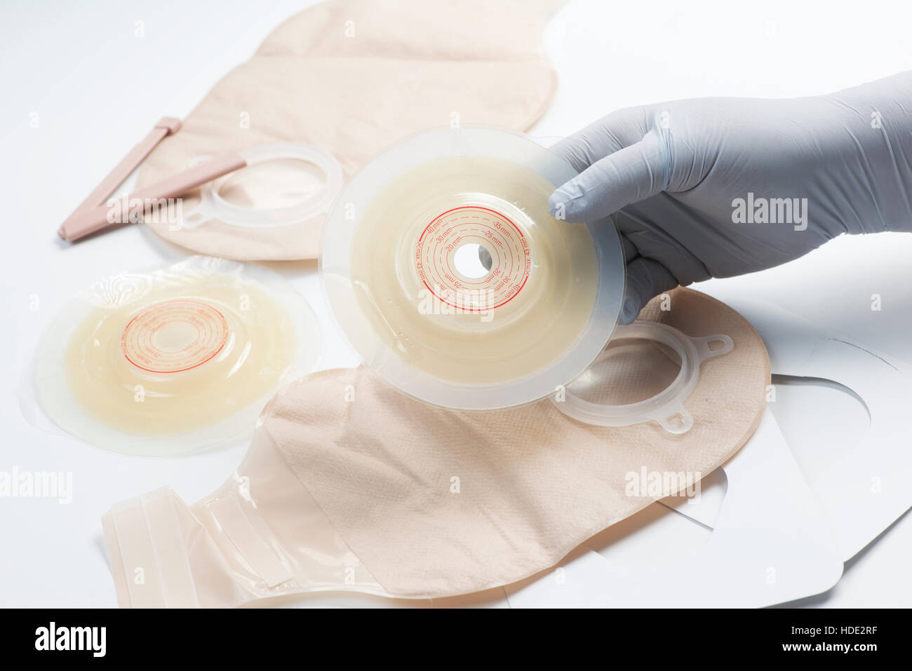 Nurse prepares ostomy supplies for use with patient Stock Photo - Alamy