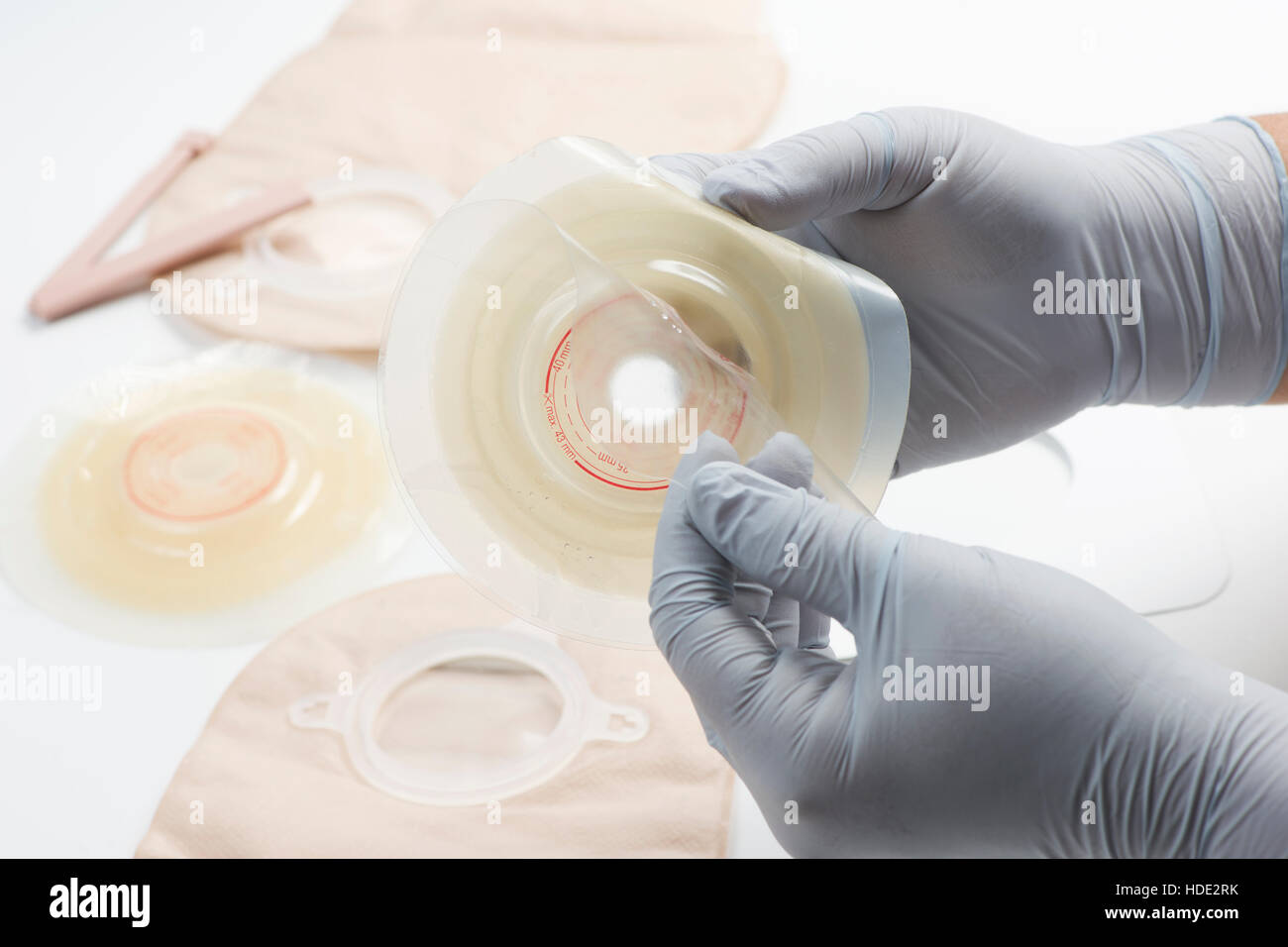 Nurse prepares ostomy supplies for use with patient Stock Photo - Alamy