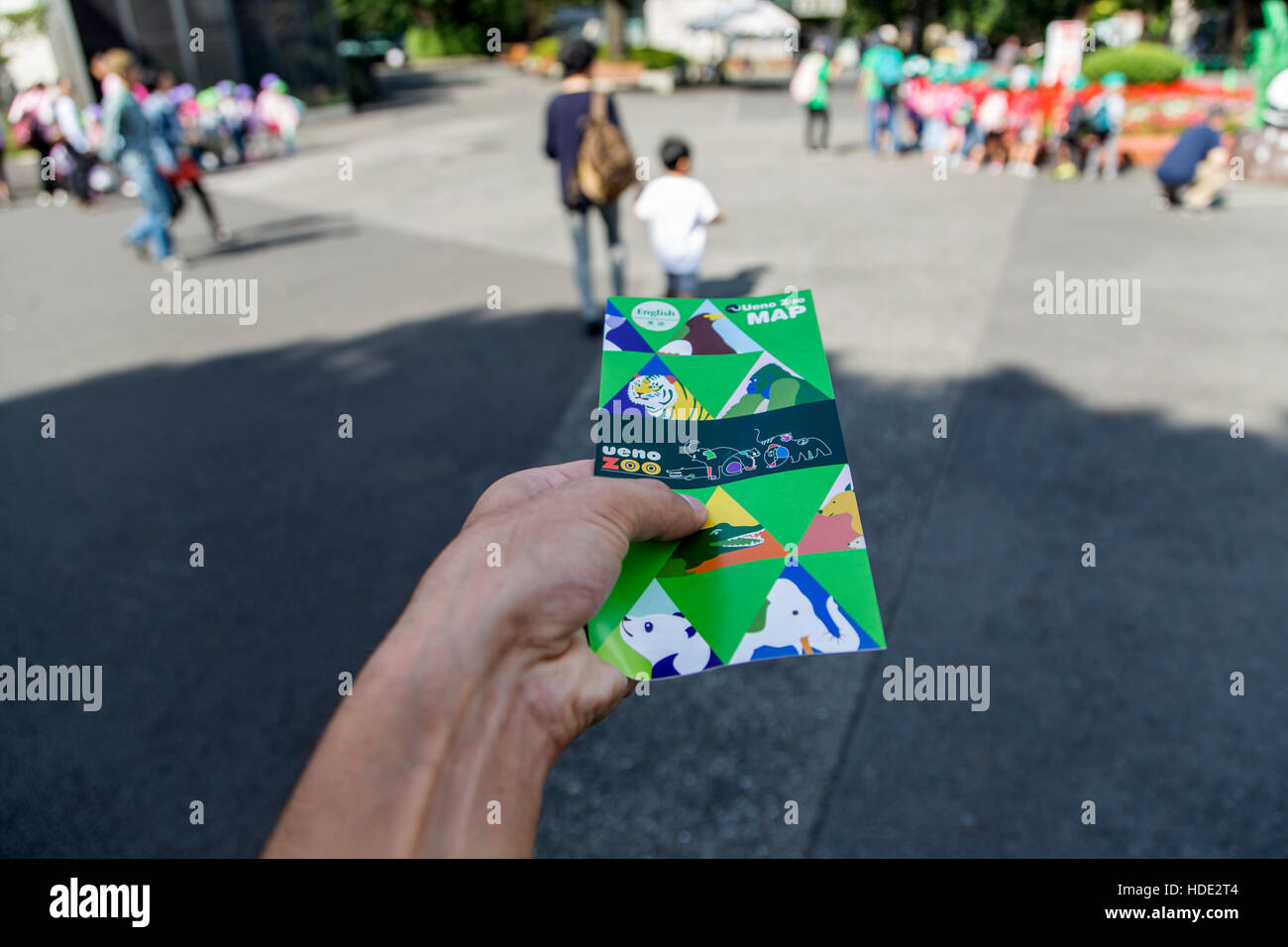 Man holding ticket from Ueno zoo in Tokyo, Japan. It is Japan oldest ...