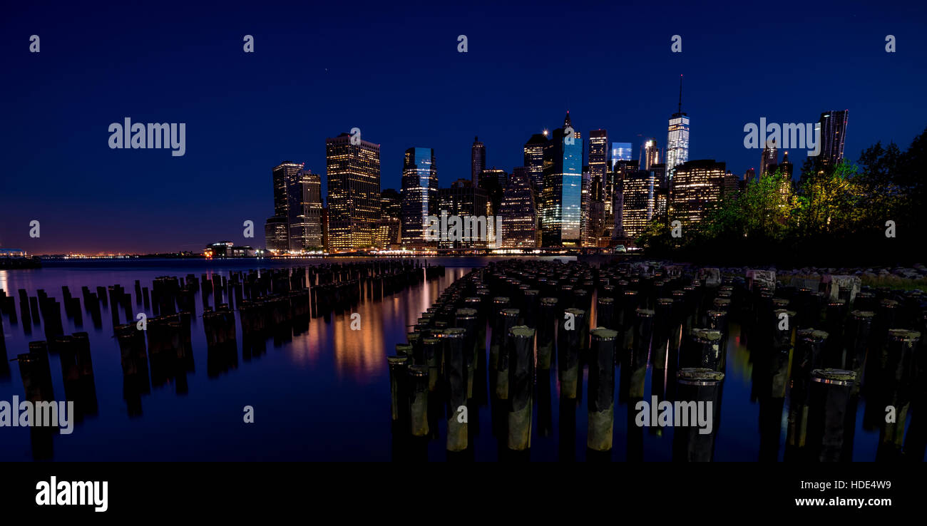 Unique view of New York city with pylons in the water Stock Photo - Alamy