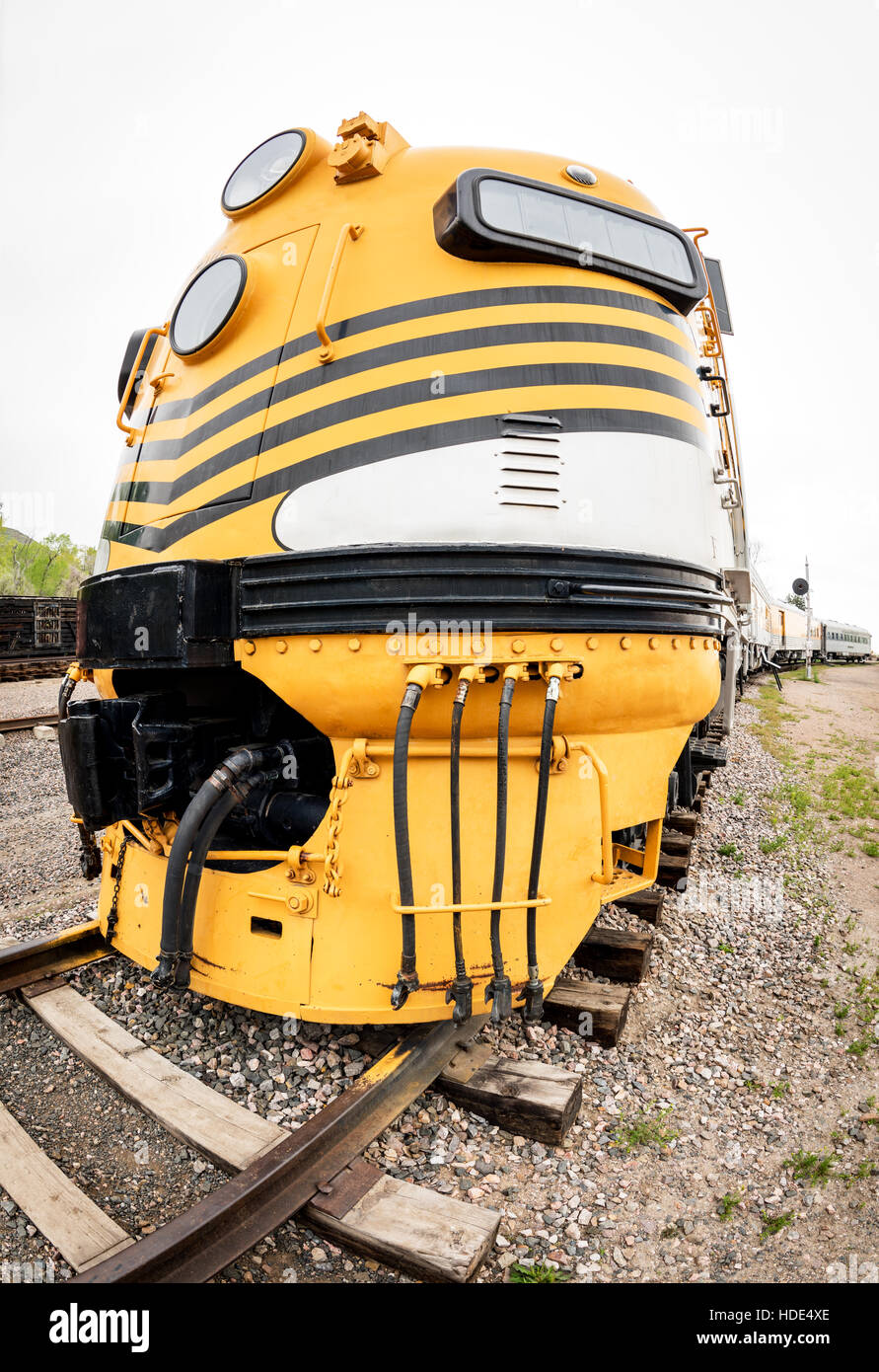 Bright yellow modern train engine close up Stock Photo - Alamy