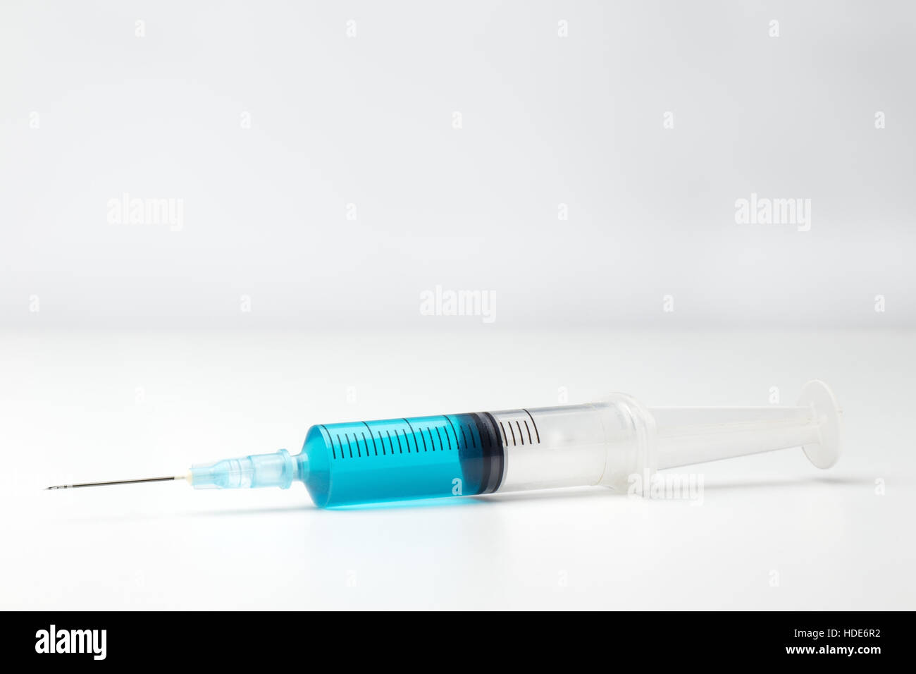 single syringe shot in the studio on white Stock Photo - Alamy