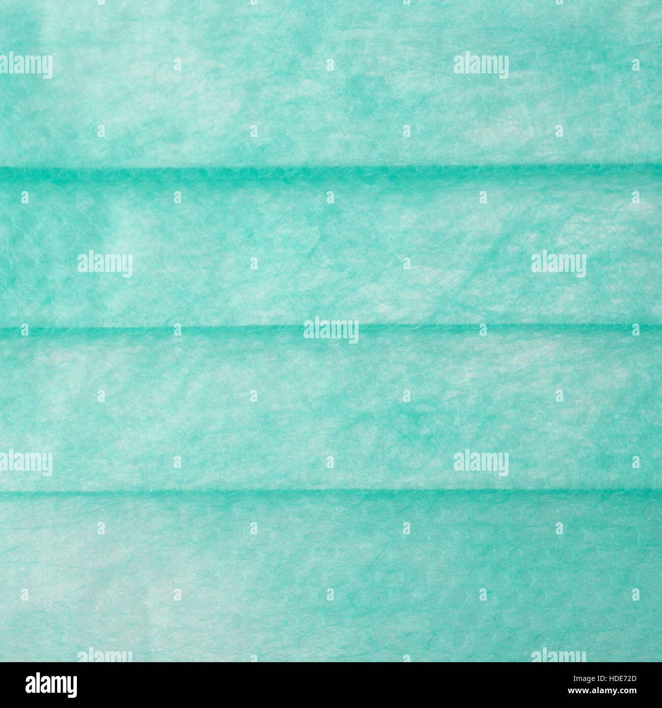 Green medical surgical protective mask texture as abstract background ...