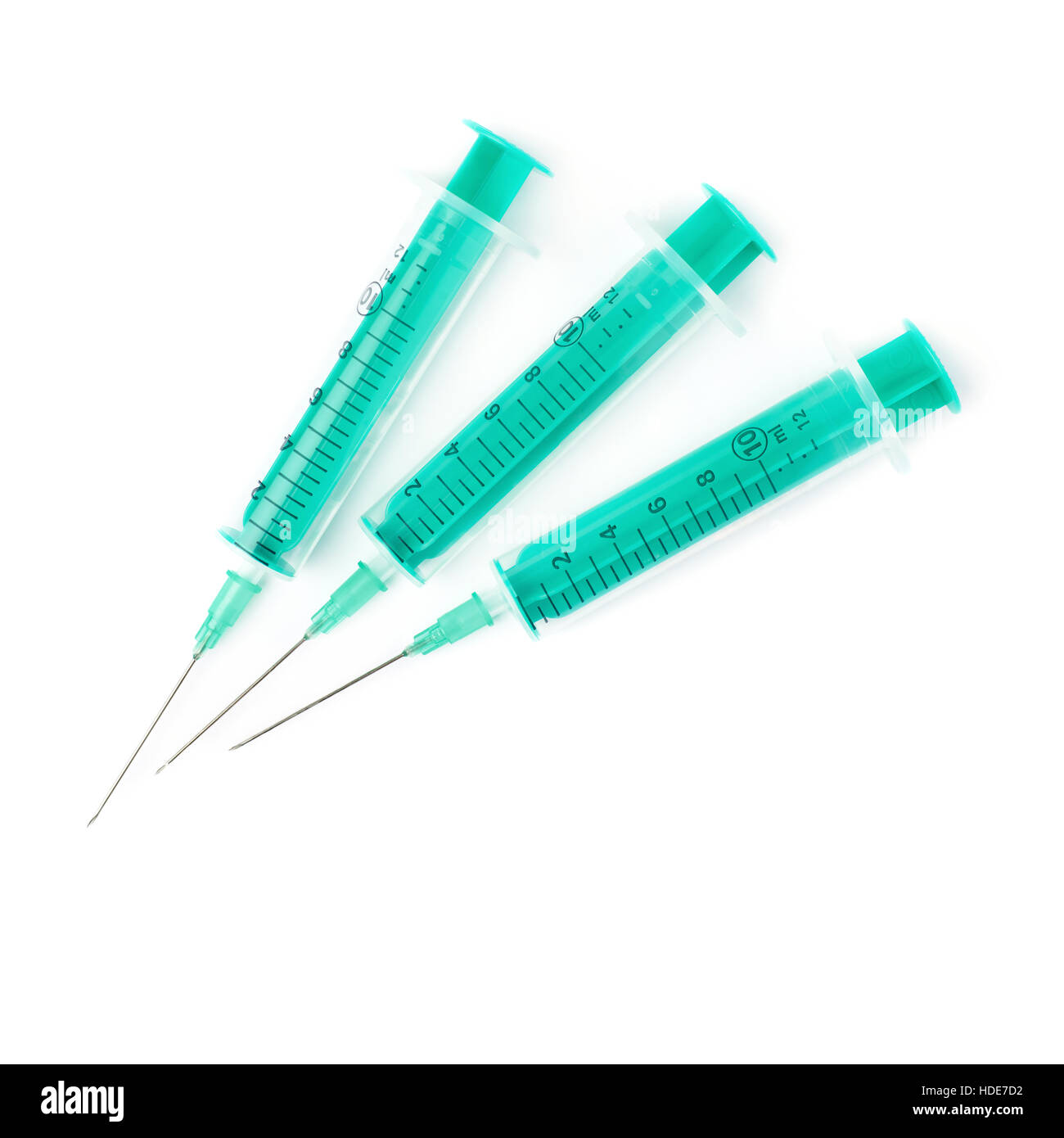 Medical syringes with needles lying isolated over white background ...