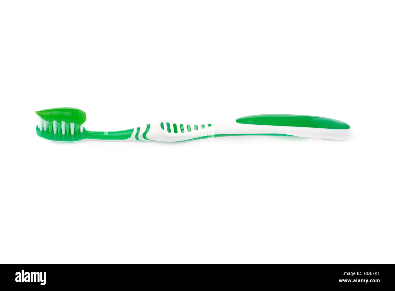 Green toothbrush with paste isolated over white background Stock Photo ...