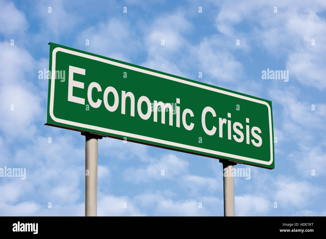 Economic Crisis Green Road Sign, Against Light Cloudscape Sky Stock ...