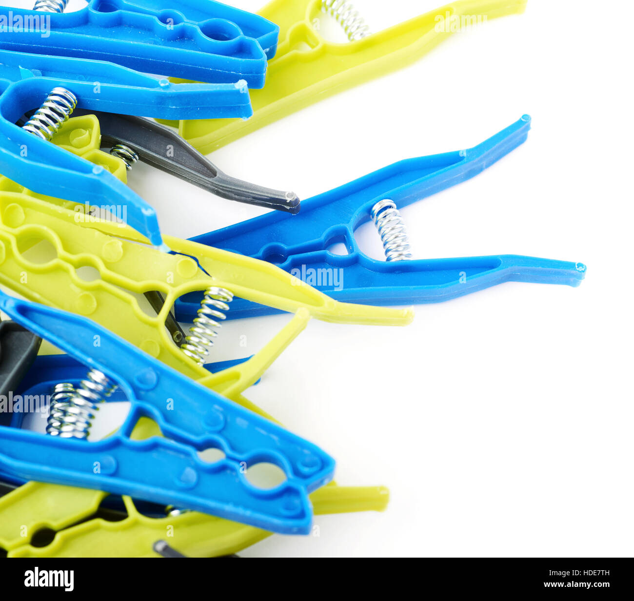 Pile of cloth pegs isolated over white background Stock Photo - Alamy