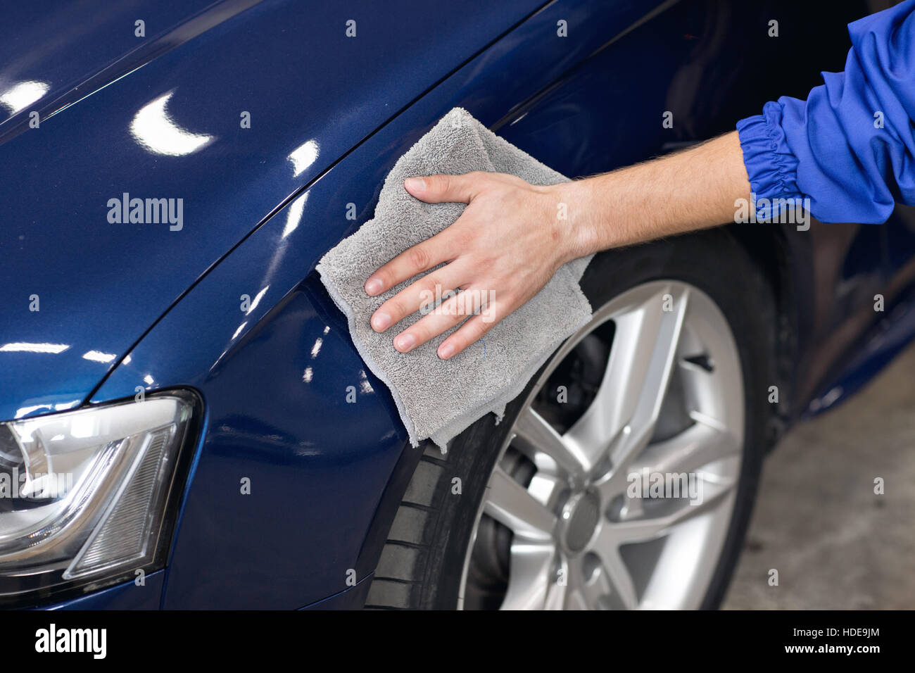 man polishing cleaning car with microfiber cloth, detailing or valeting ...