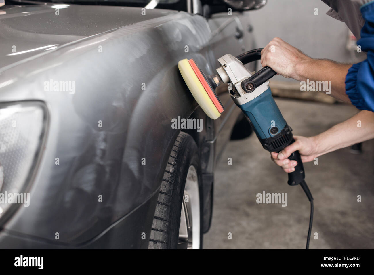 man polishing cleaning car with microfiber cloth, detailing or valeting ...