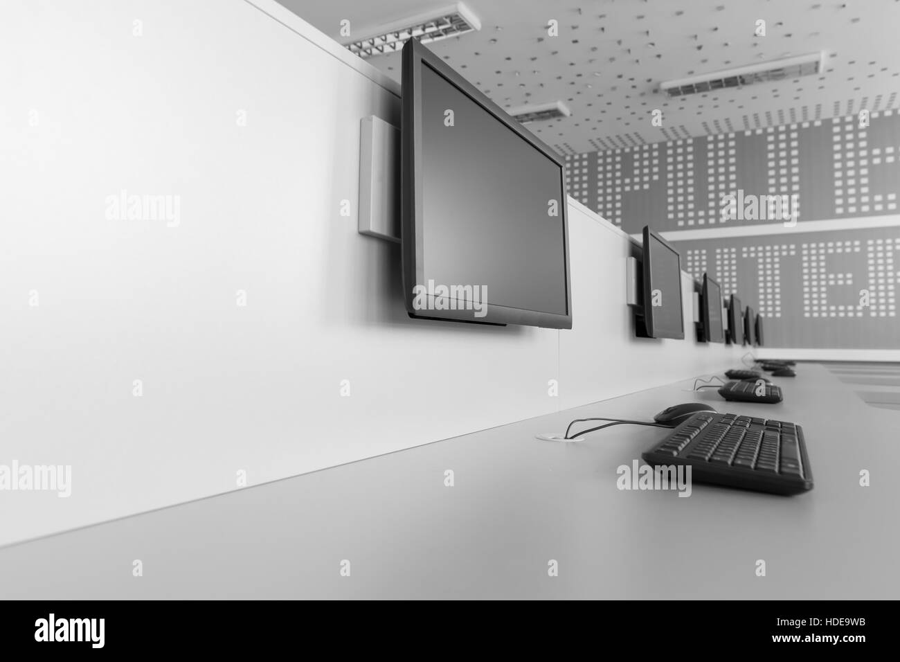 Workplace room with computers in row Stock Photo - Alamy