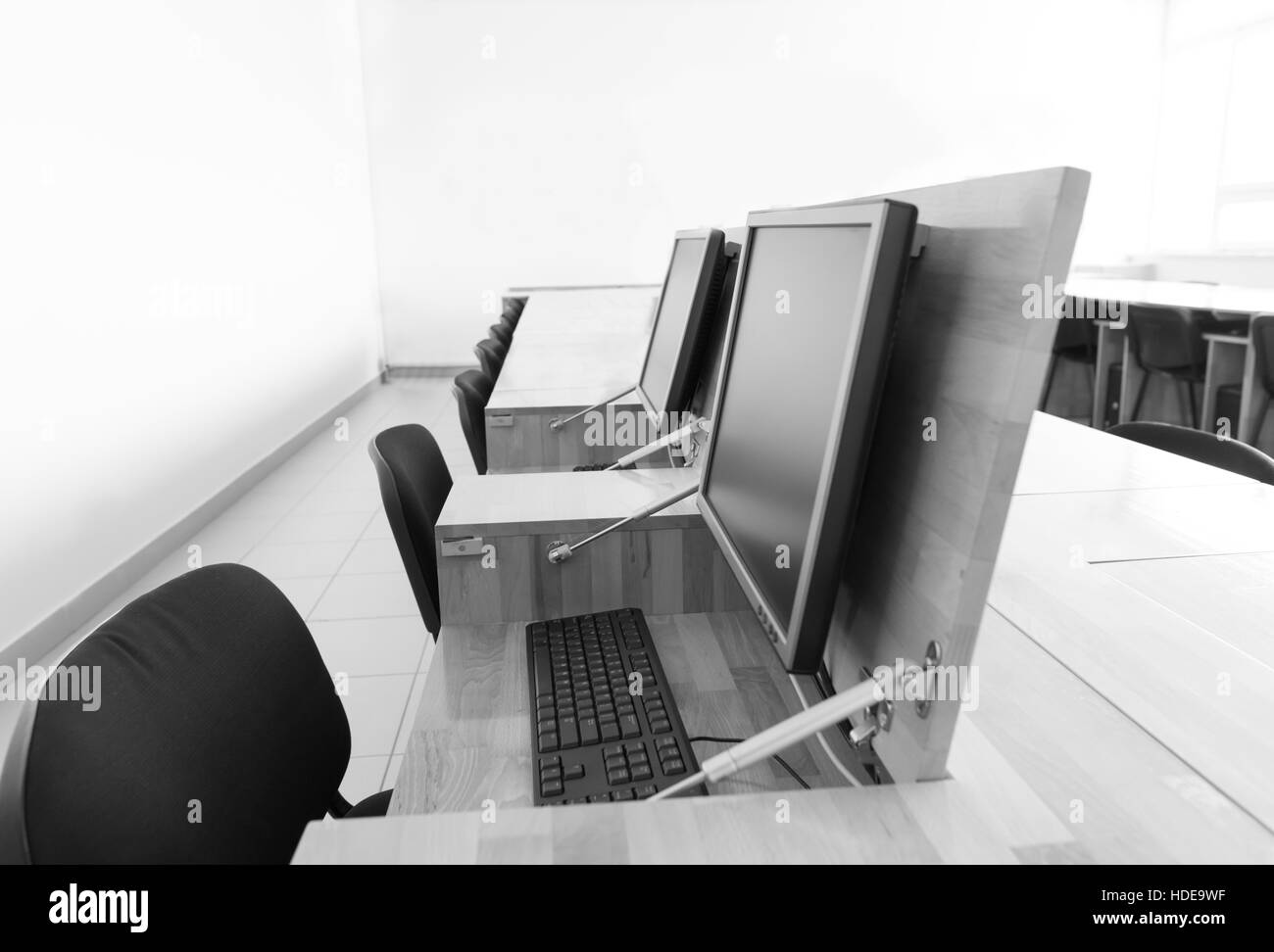 Workplace room with computers in row Stock Photo - Alamy