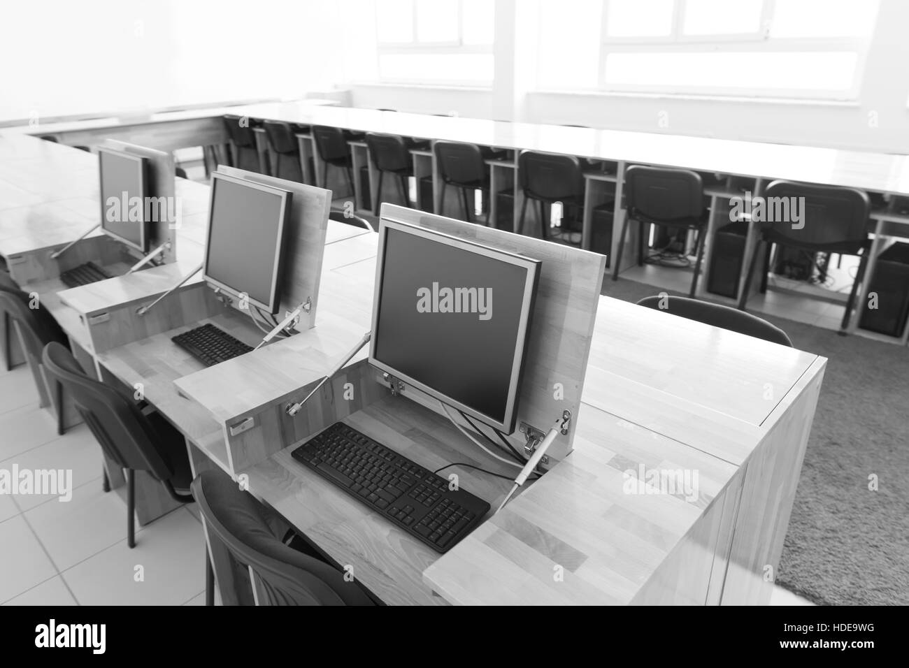 Workplace room with computers in row Stock Photo - Alamy