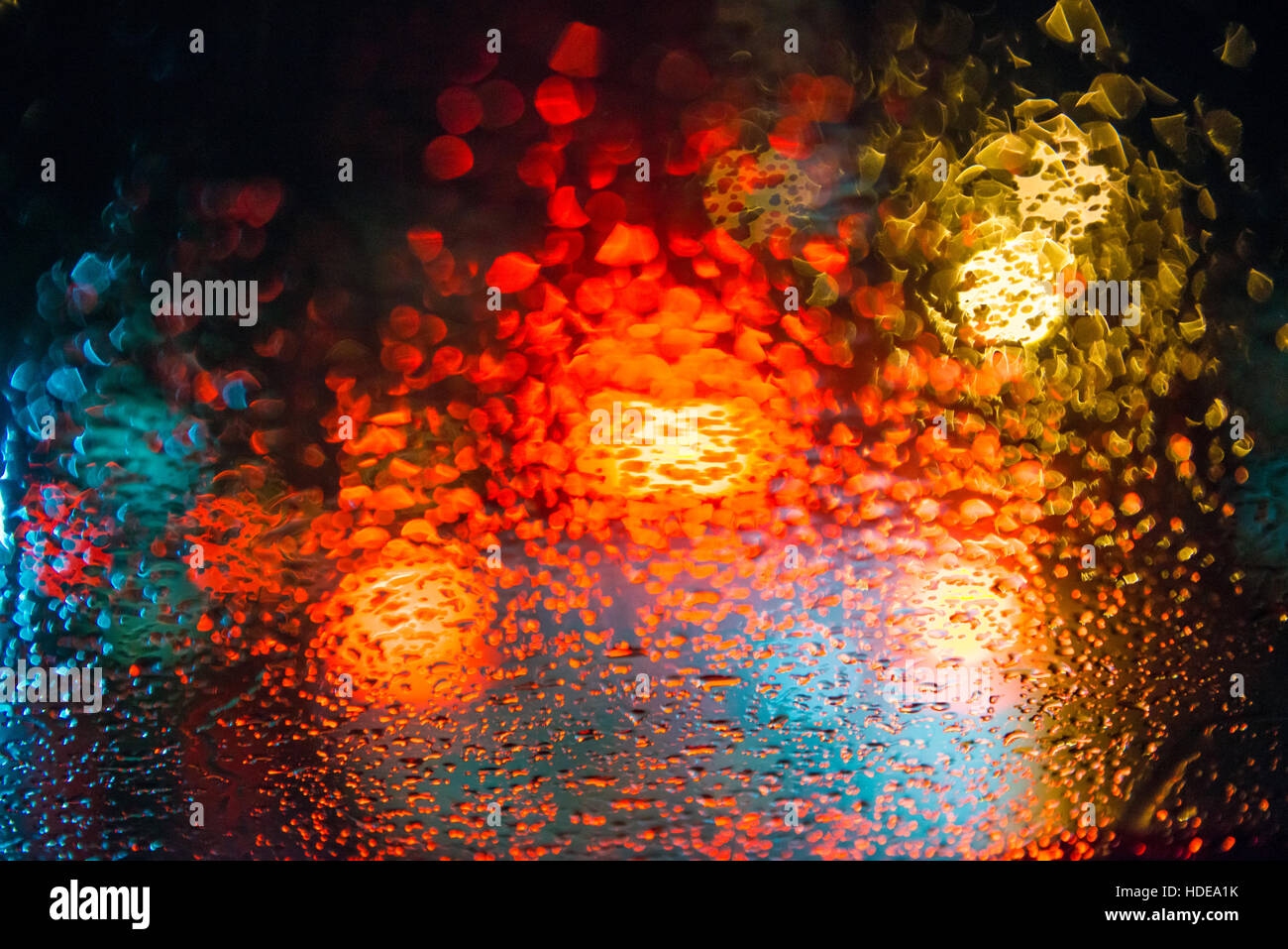 Rain drops on window with street bokeh lights Stock Photo - Alamy