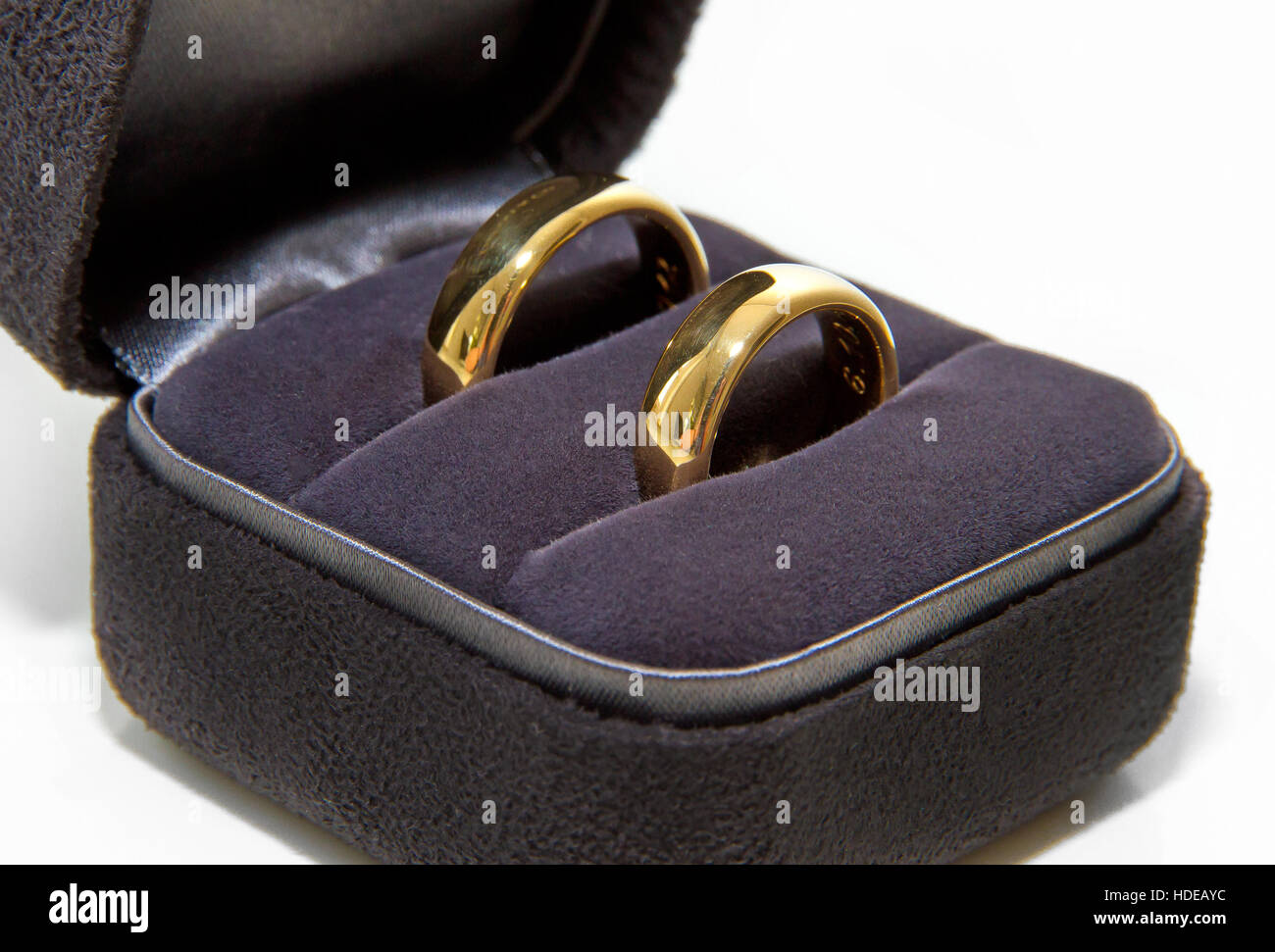Two wedding rings in a case Stock Photo - Alamy