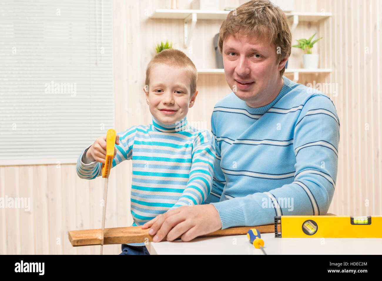 Father son working in garage hi-res stock photography and images - Alamy