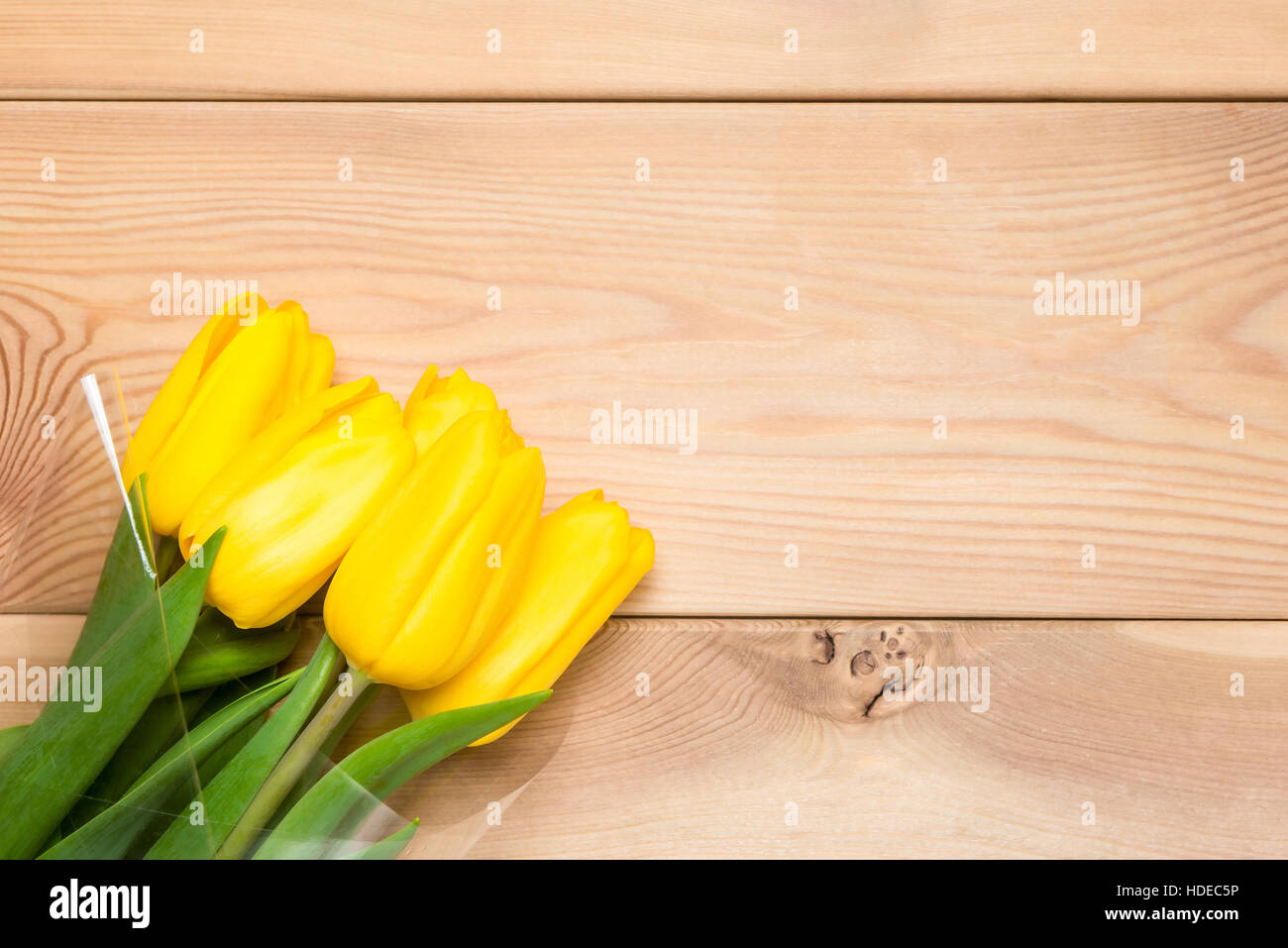 beautiful yellow tulips and space wooden boards background Stock Photo ...