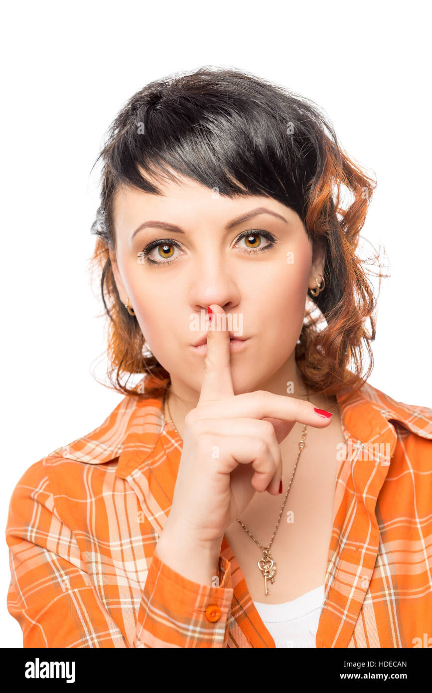 girl shows gesture that you need be quieter on a white background Stock ...