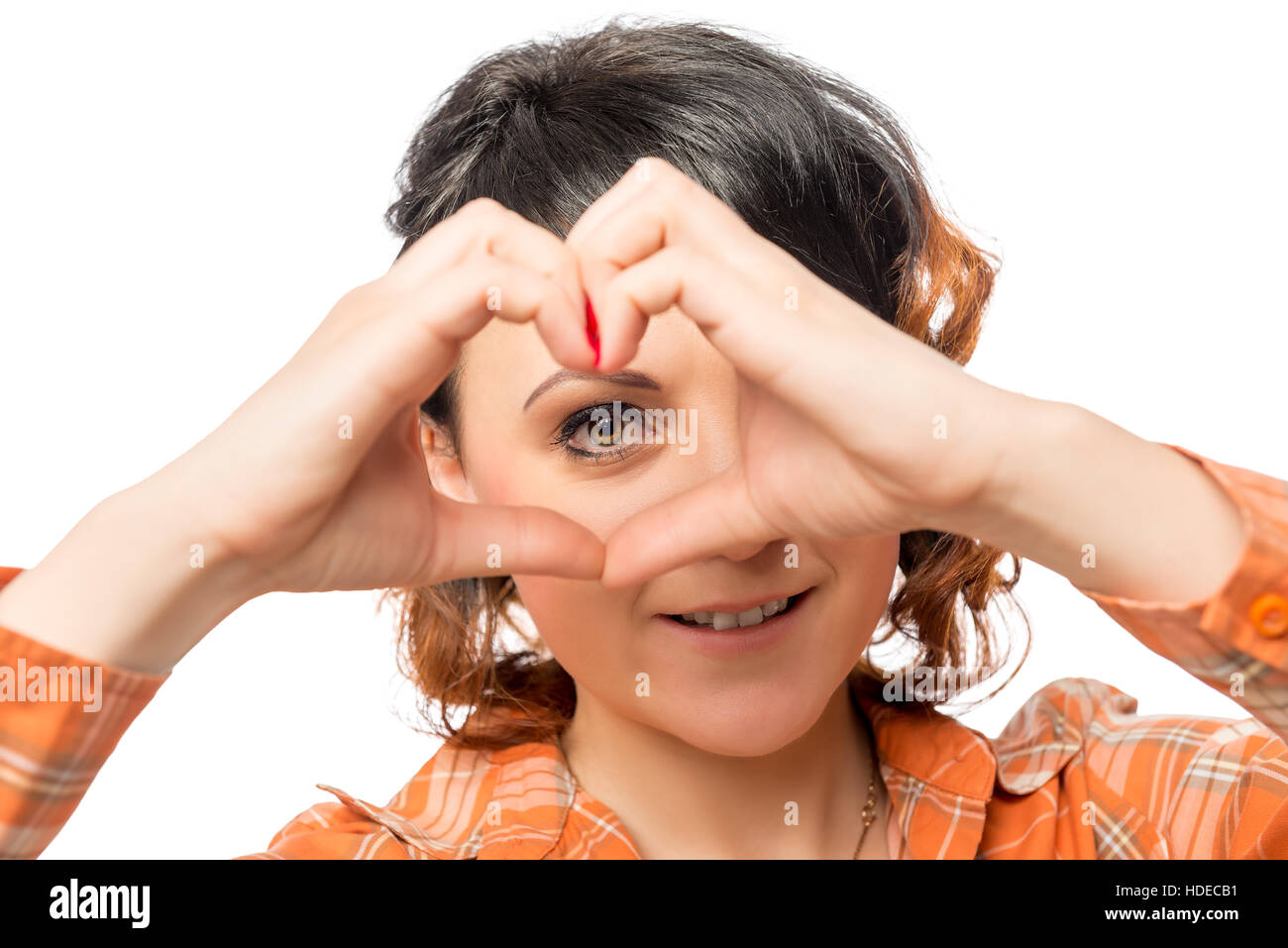young girl shows hands a heart on a white background Stock Photo - Alamy
