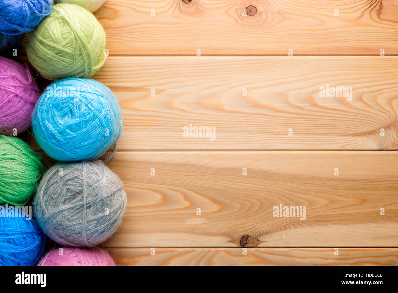 bunch of multi-colored woolen thread and space on the right in the top ...