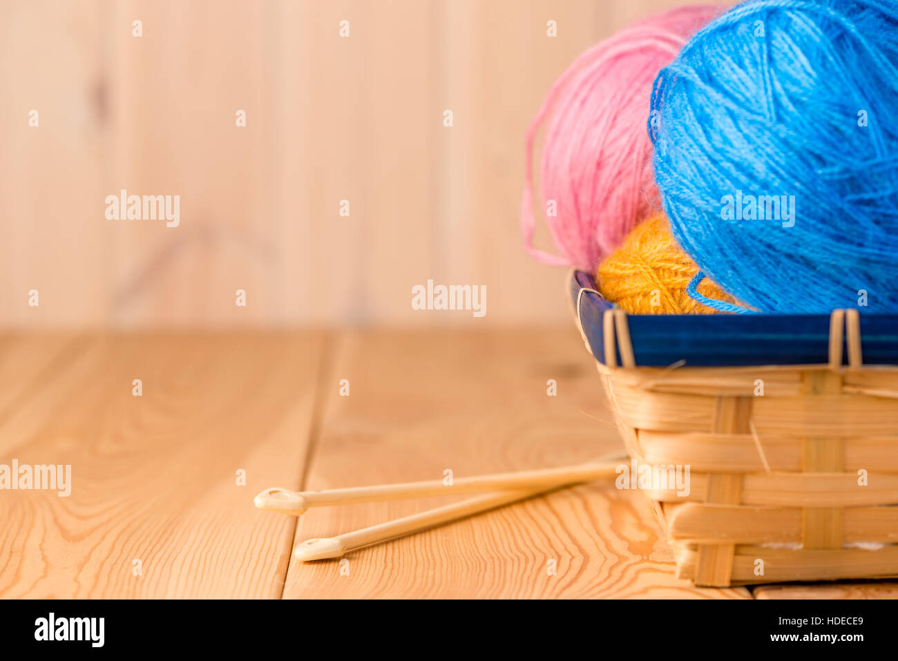 balls of yarn in a basket for hand work Stock Photo - Alamy