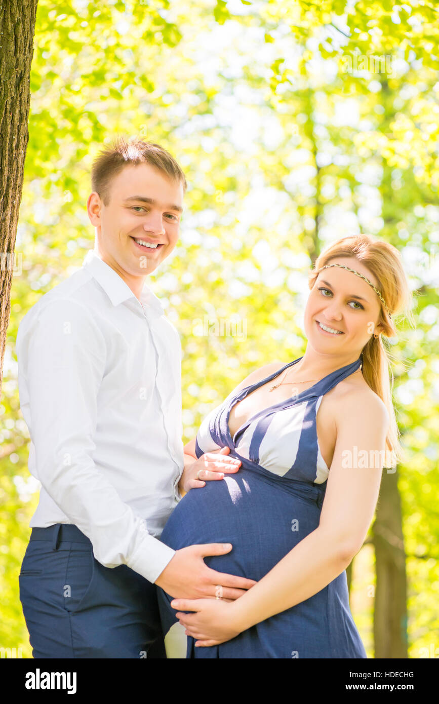 Vertical portrait of happy couple waiting for baby Stock Photo - Alamy