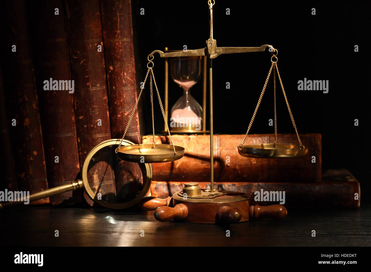Vintage still life. Weight scale and tools on background with old books ...