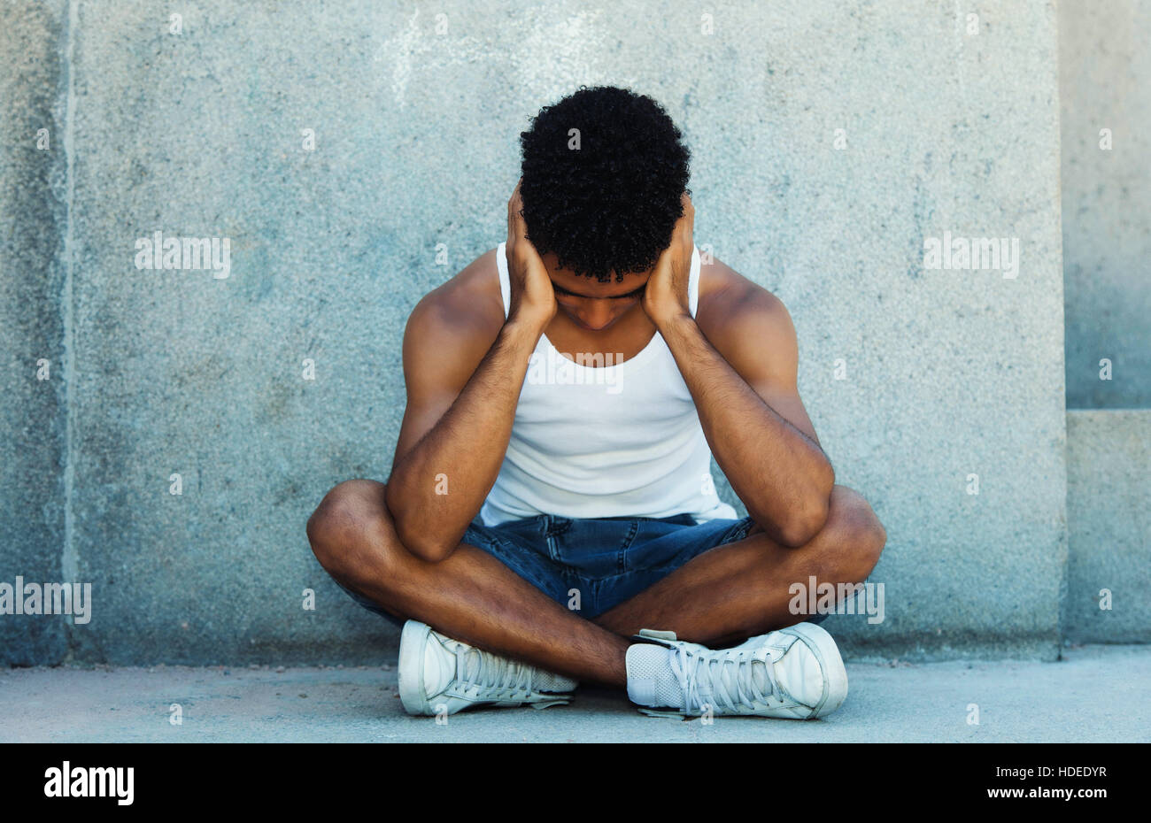 Poor homeless latin young adult thinking about his problems Stock Photo ...