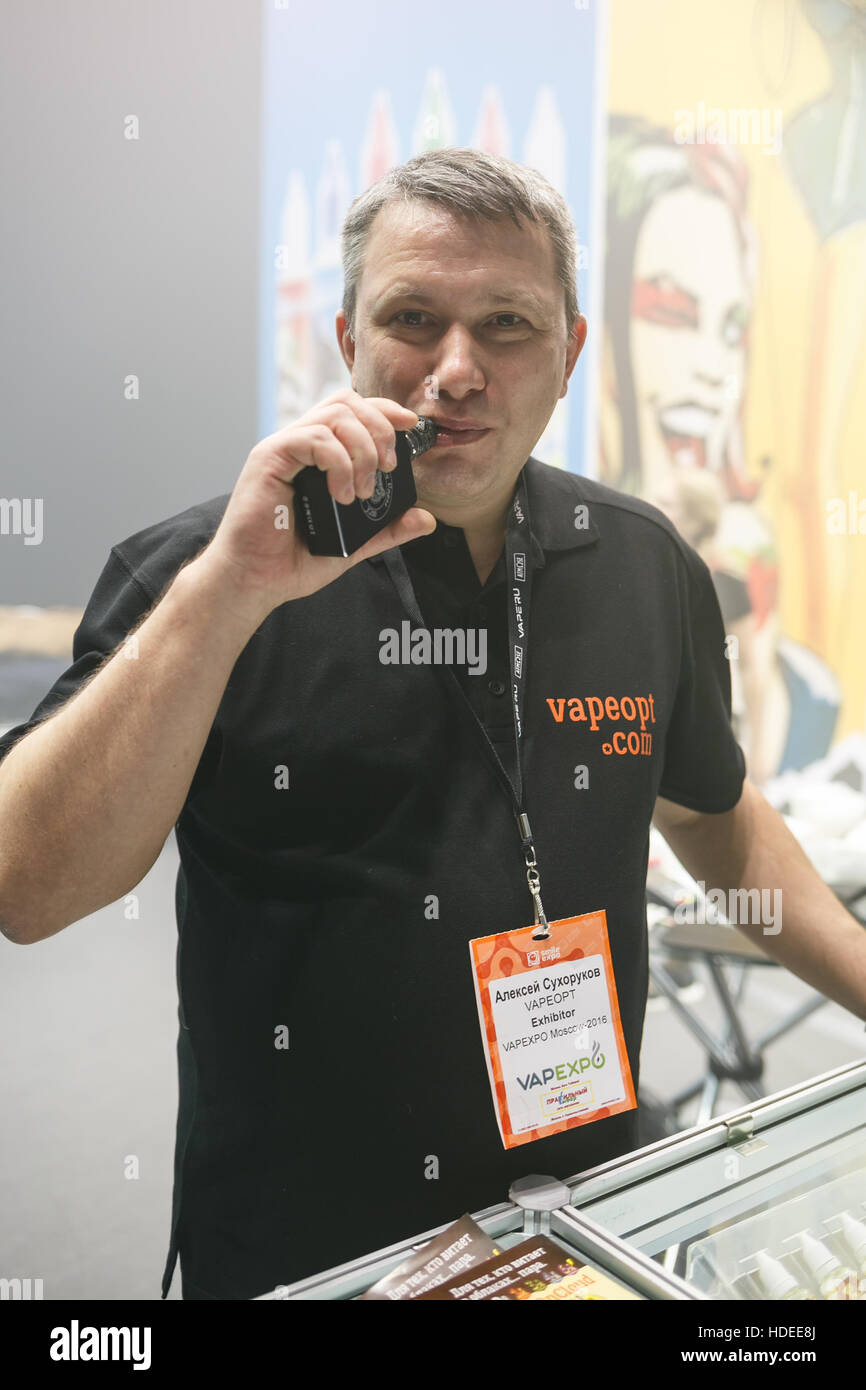 MOSCOW - 9 DECEMBER,2016: International Vape Expo.People at big vaping ...