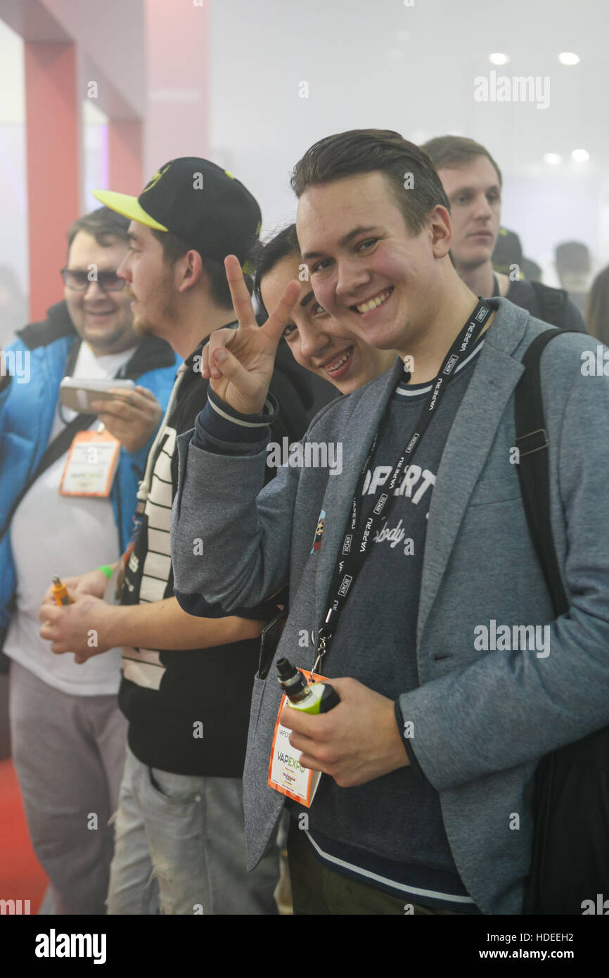 MOSCOW - 9 DECEMBER,2016: International Vape Expo.People at big vaping ...
