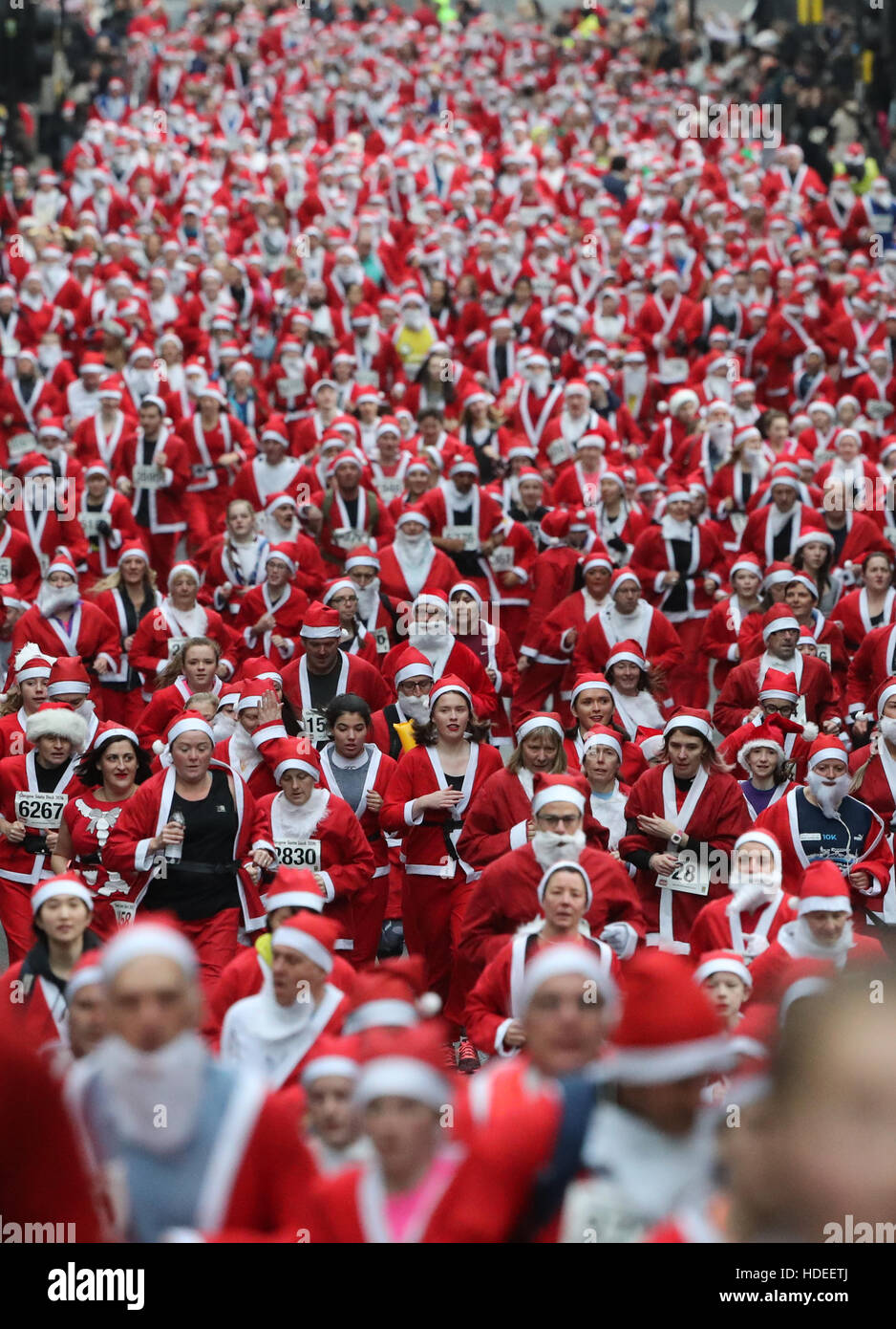 Thousands of runners in Santa costumes take part in the Glasgow Santa ...