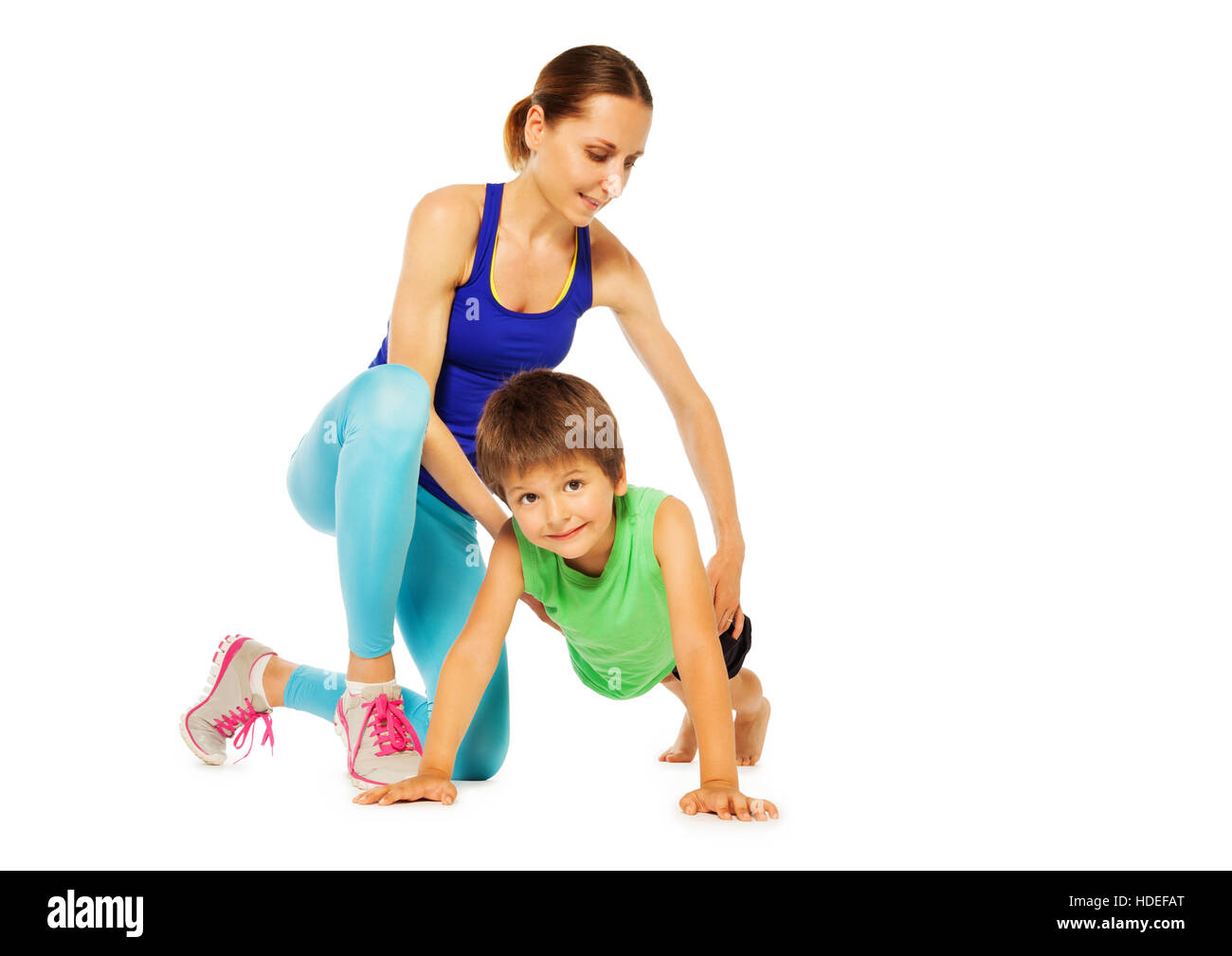 Sporty mother teaching her son doing pushing ups Stock Photo - Alamy