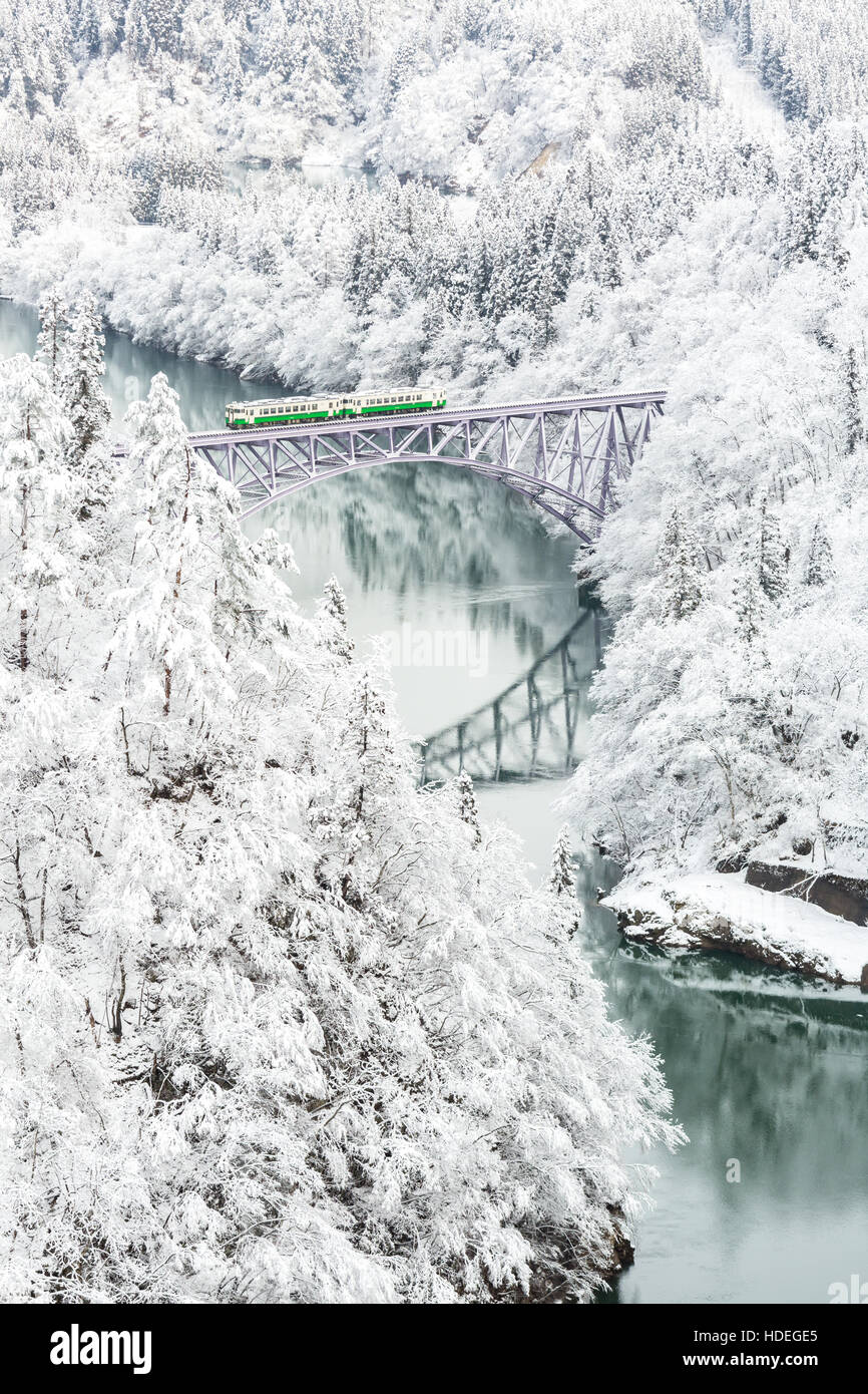 Winter landscape snow covered trees with train crossin River on Bridge ...