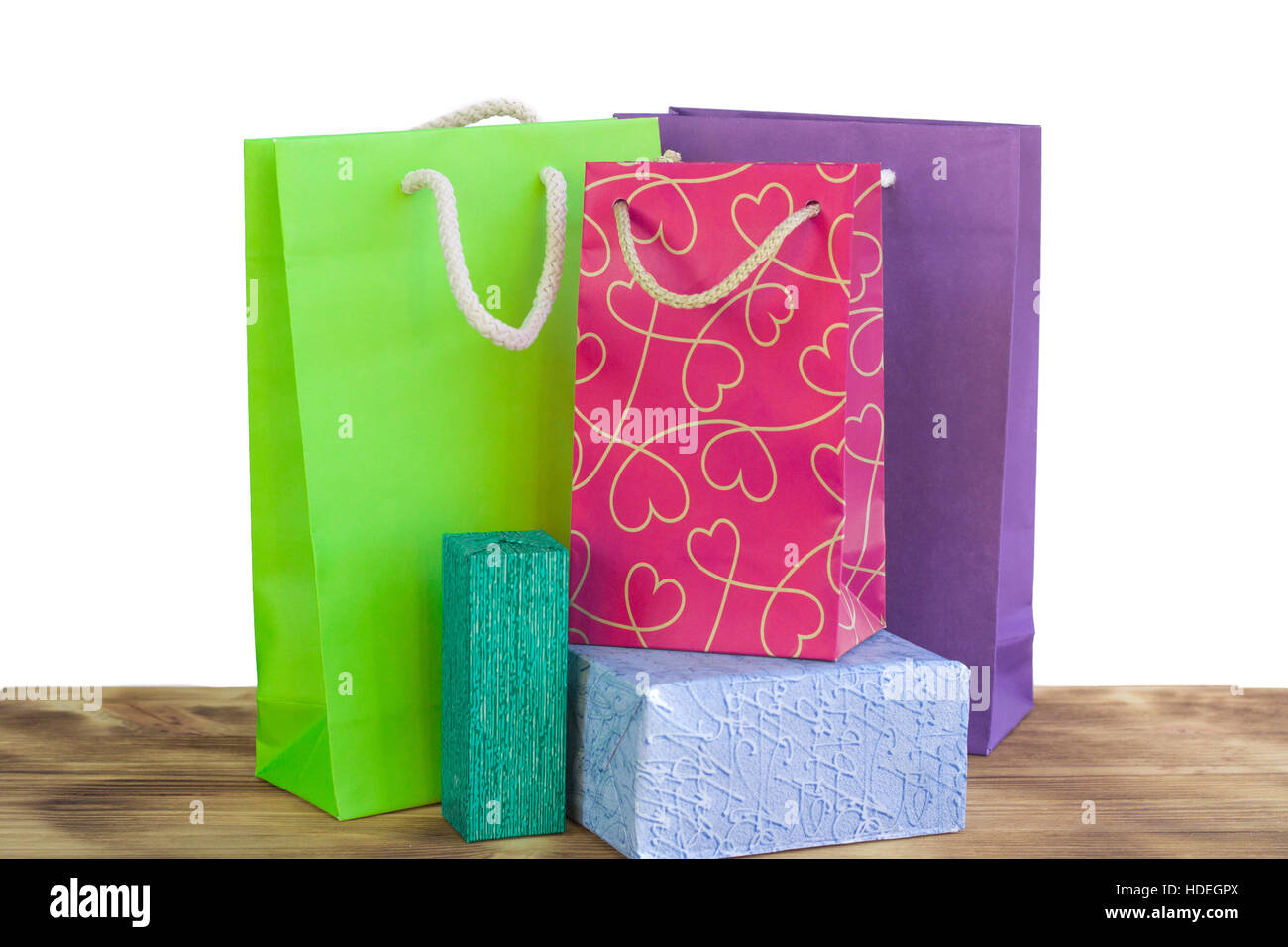 Colourful and bright shopping packages for gifts and presents on wooden ...