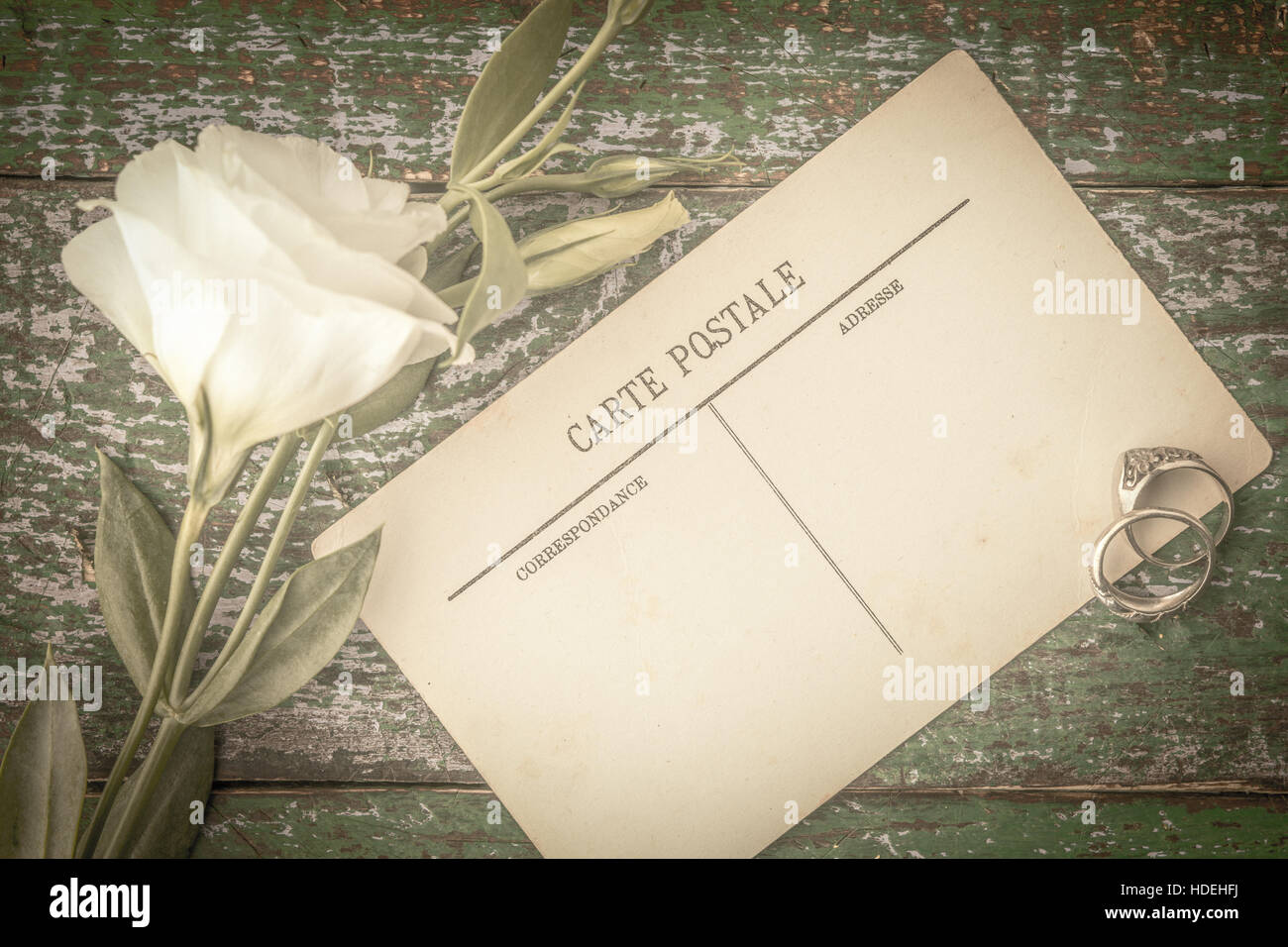 Postcards with ring and flowers on the wooden table top view Stock ...