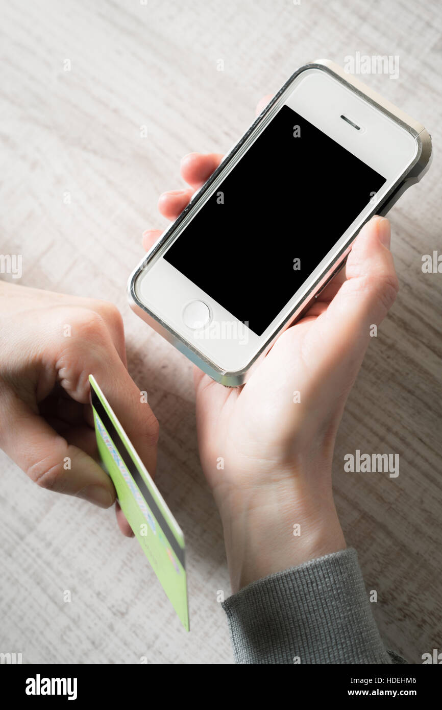 mobile phone telephone cellular credit card hand Stock Photo - Alamy