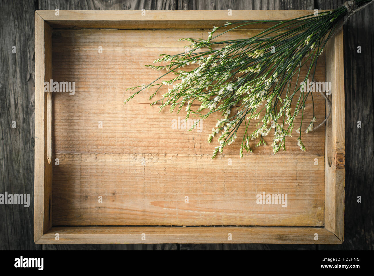 Wooden tray with flowers top view Stock Photo - Alamy