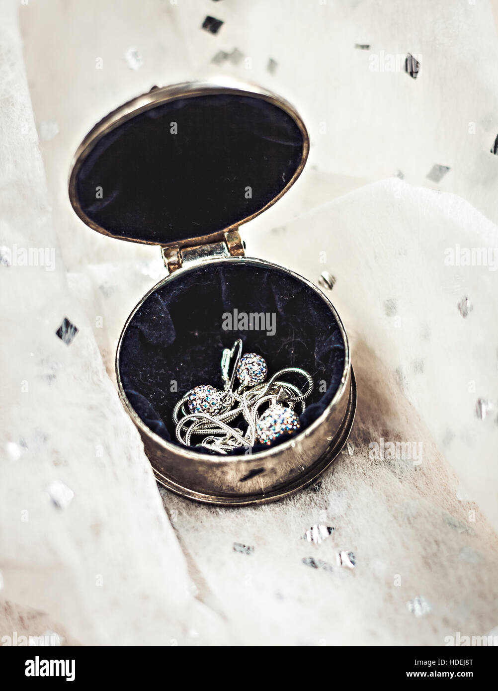 vintage metal forged round box with jewelery Stock Photo - Alamy
