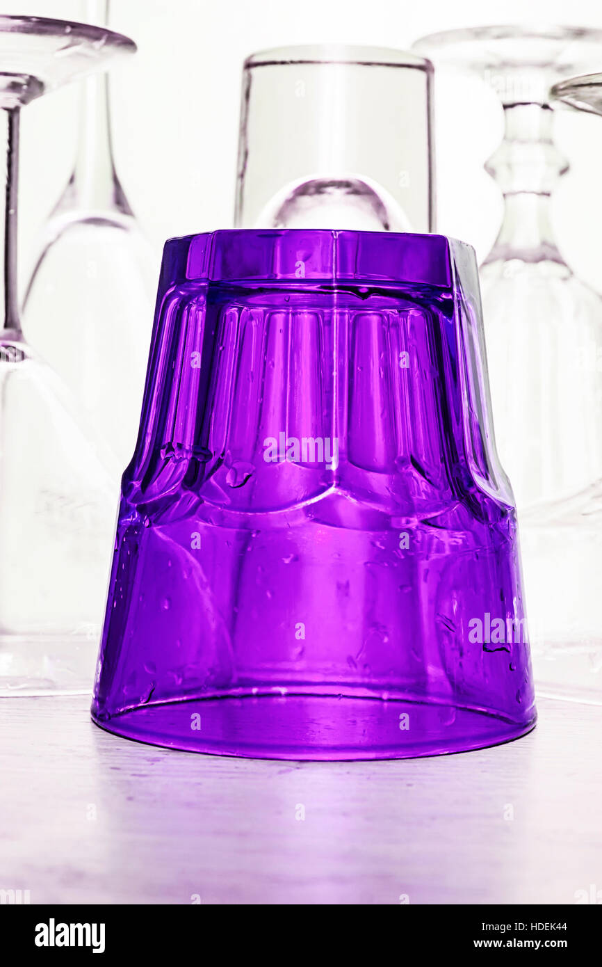 Glass goblets of different shapes and a multi-colored on a white ...