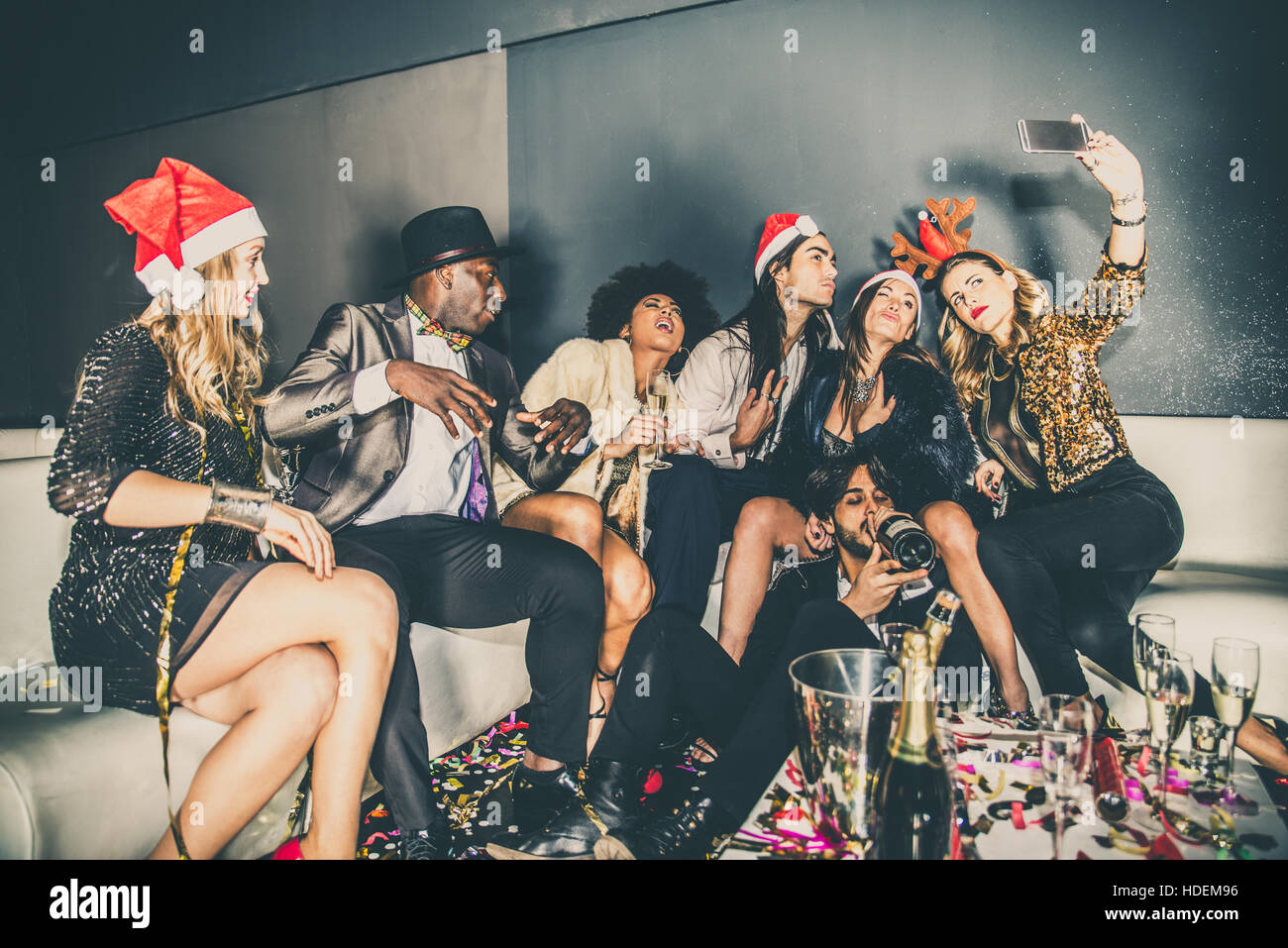 Multi-ethnic group of friends celebrating the end of the year in a ...