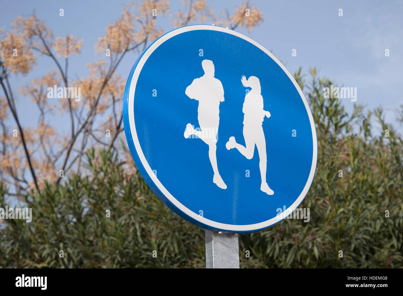 Jogging Sign in Park Setting Stock Photo - Alamy